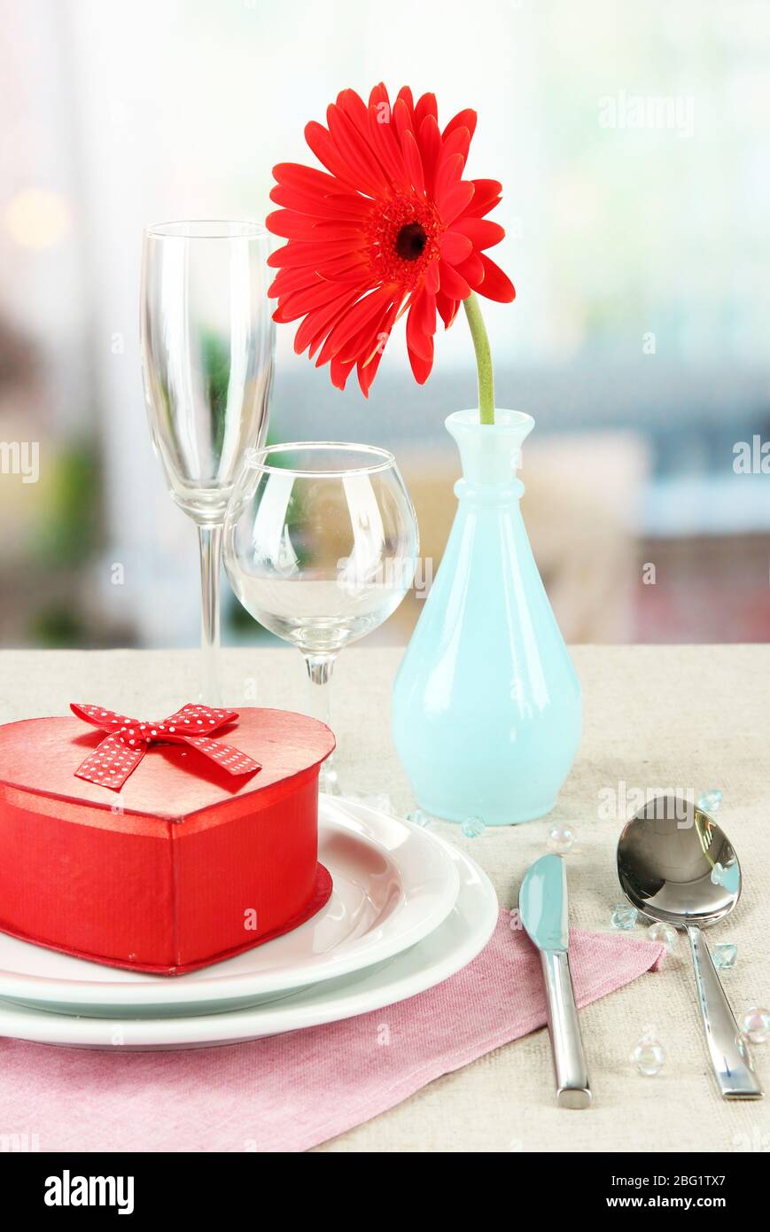 Romantic table serving on bright background Stock Photo - Alamy