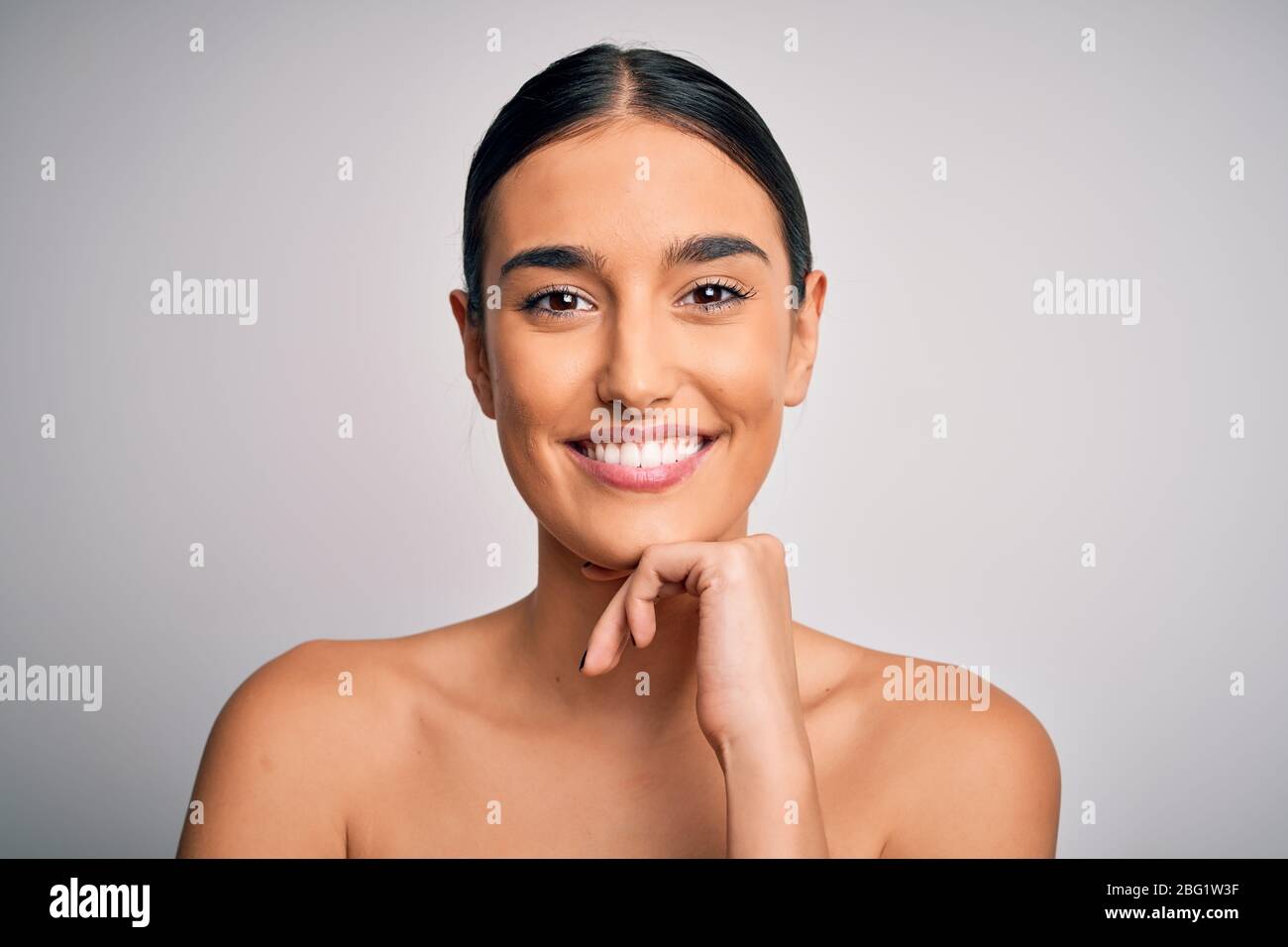 Close up of young beautiful woman with clear and pure skin. Perfect and ...