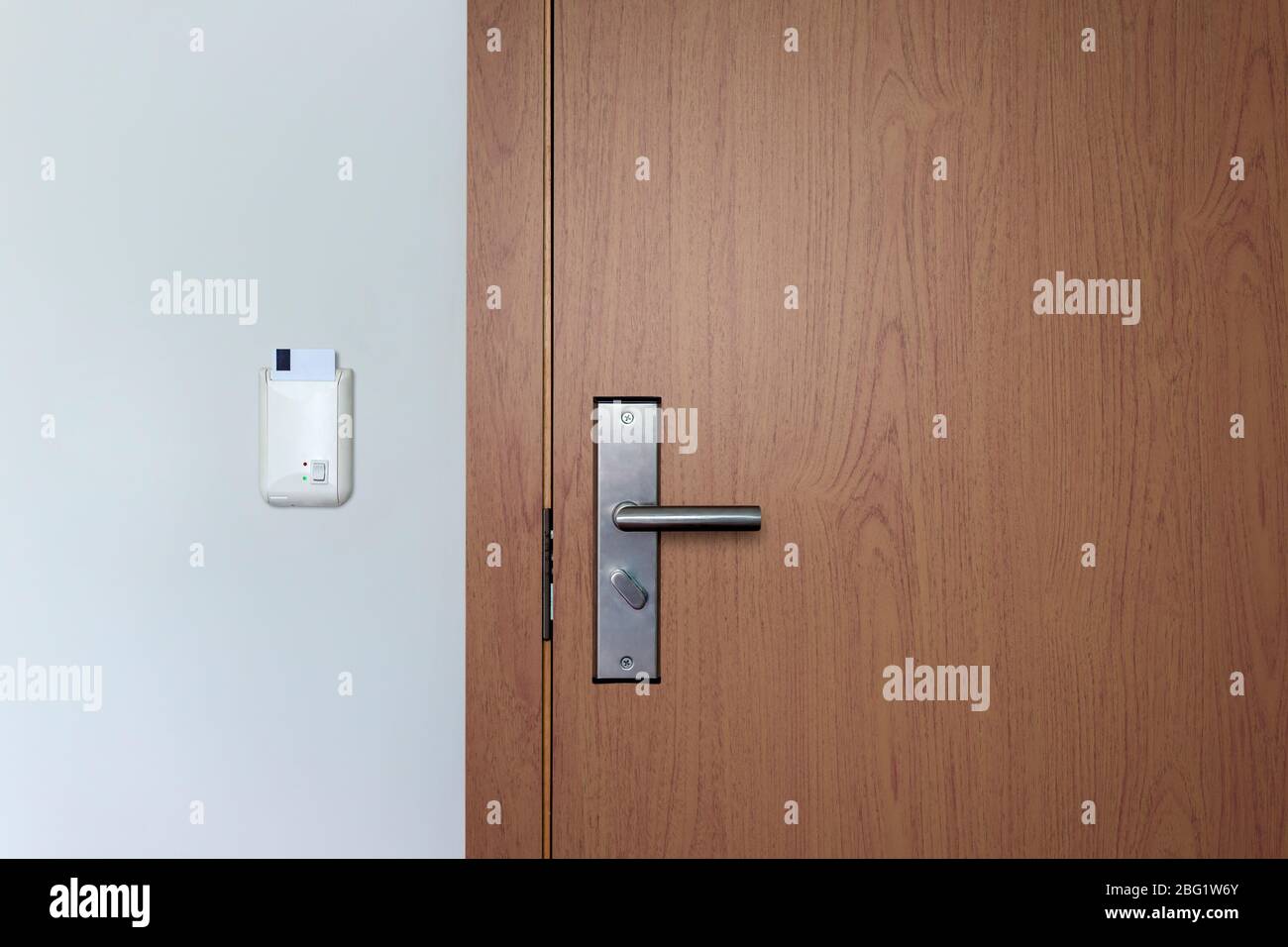 Hotel key card door lock system. Wooden door with electronic lock ...