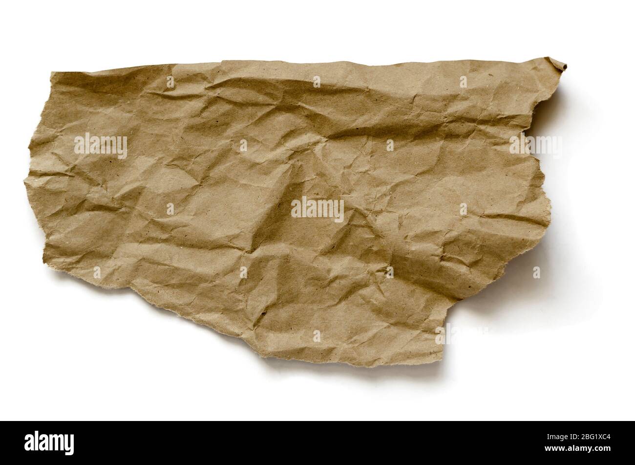 A piece of brown paper on a white background. Crumpled brown paper with ...