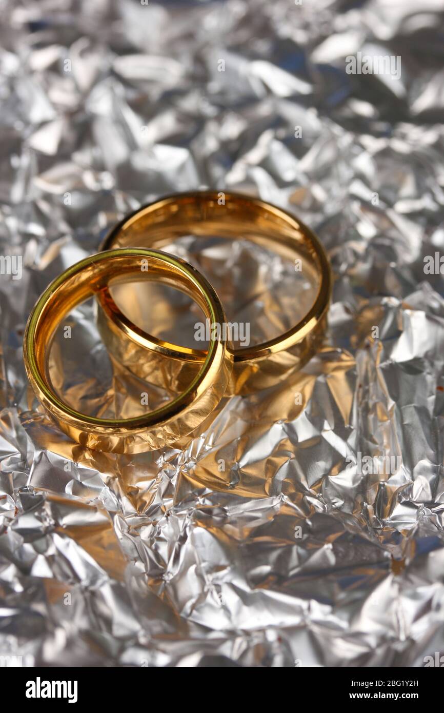 Wedding rings on silver background Stock Photo - Alamy