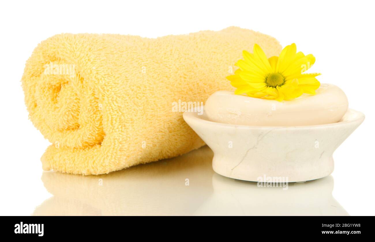 Rolled towel, soap bar and beautiful flower isolated on white Stock ...