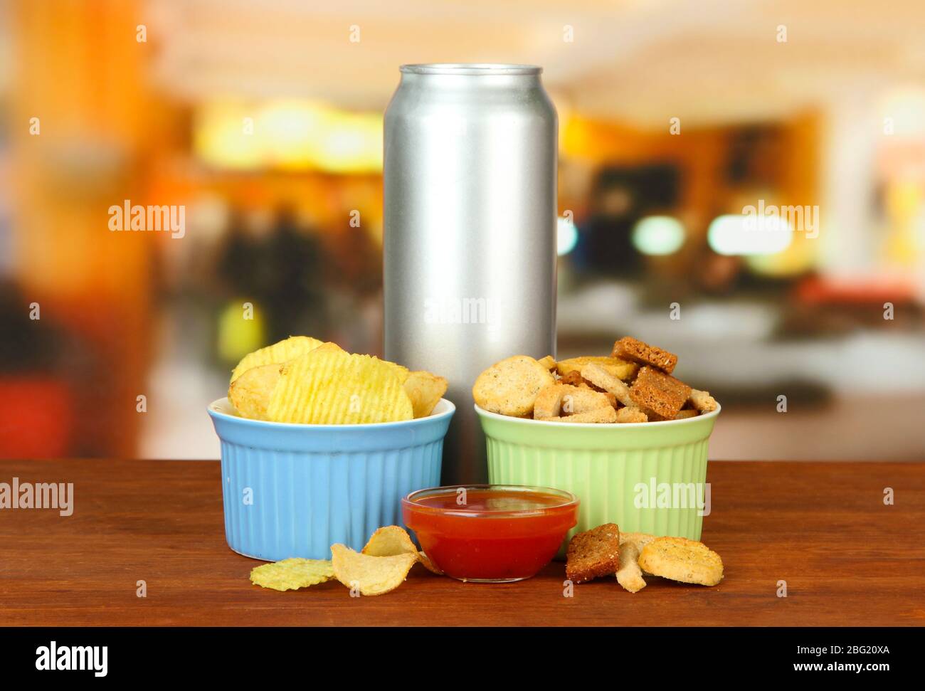 Snacks and beverage in metal can, on bright background Stock Photo - Alamy