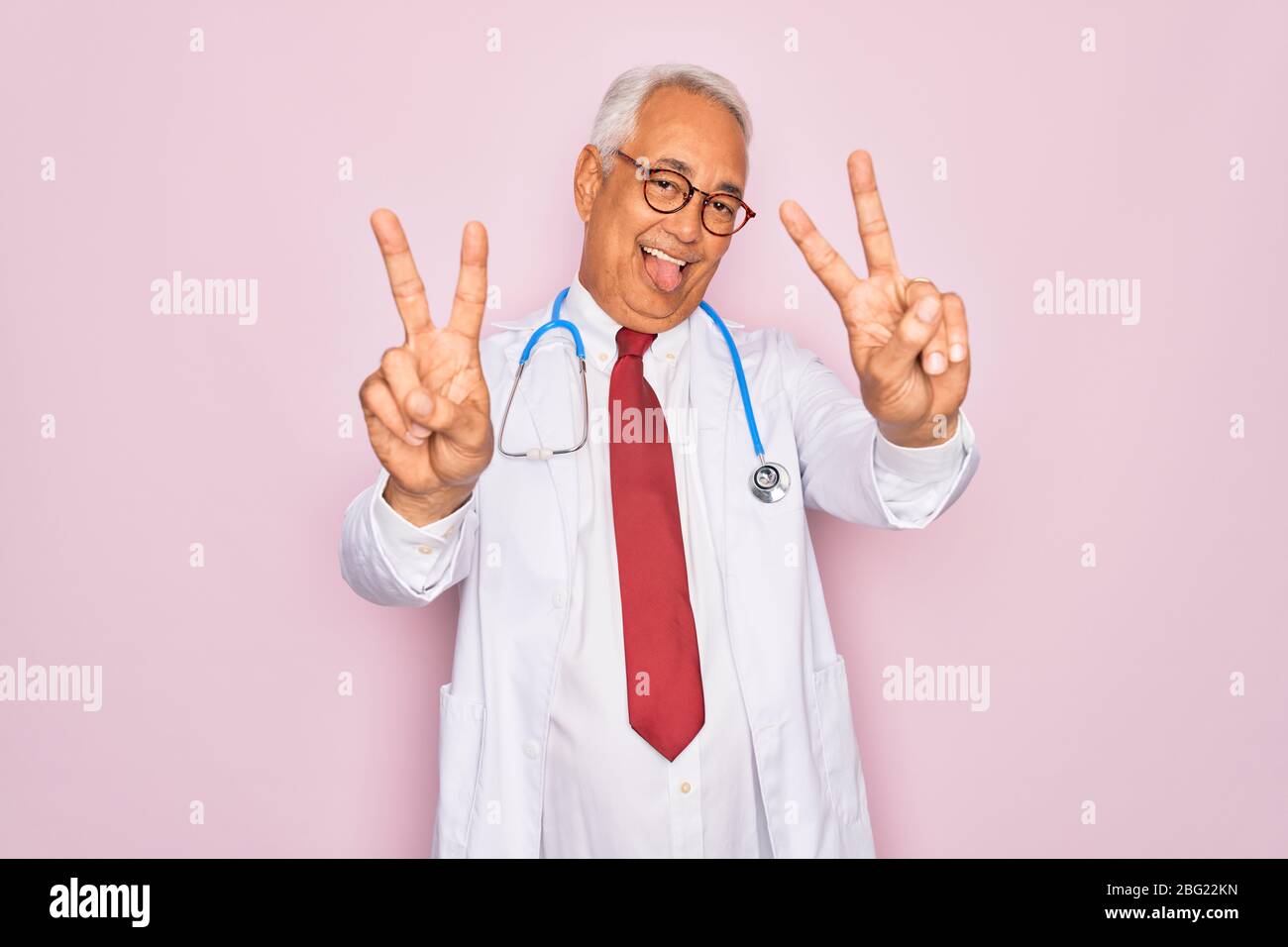 Middle age senior grey-haired doctor man wearing stethoscope and ...