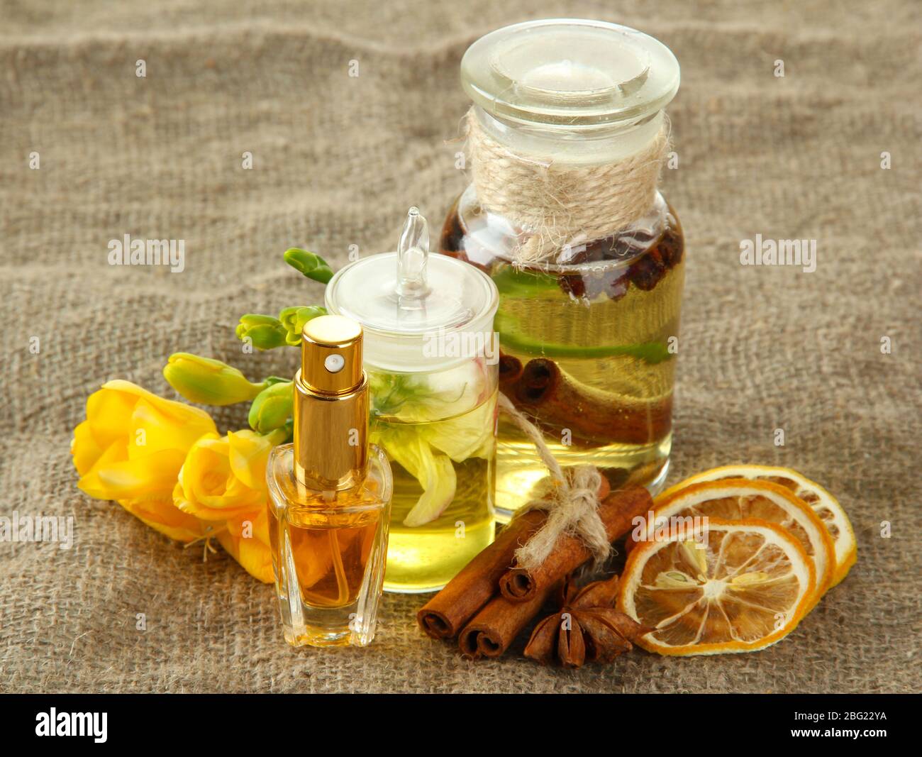 Bottles with ingredients for the perfume on burlap background Stock ...