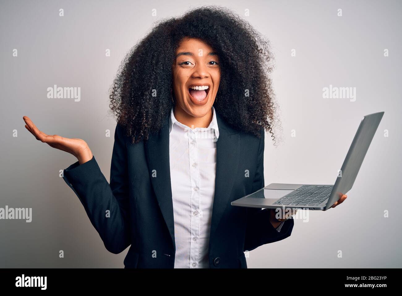 Young african american business woman with afro hair using computer ...
