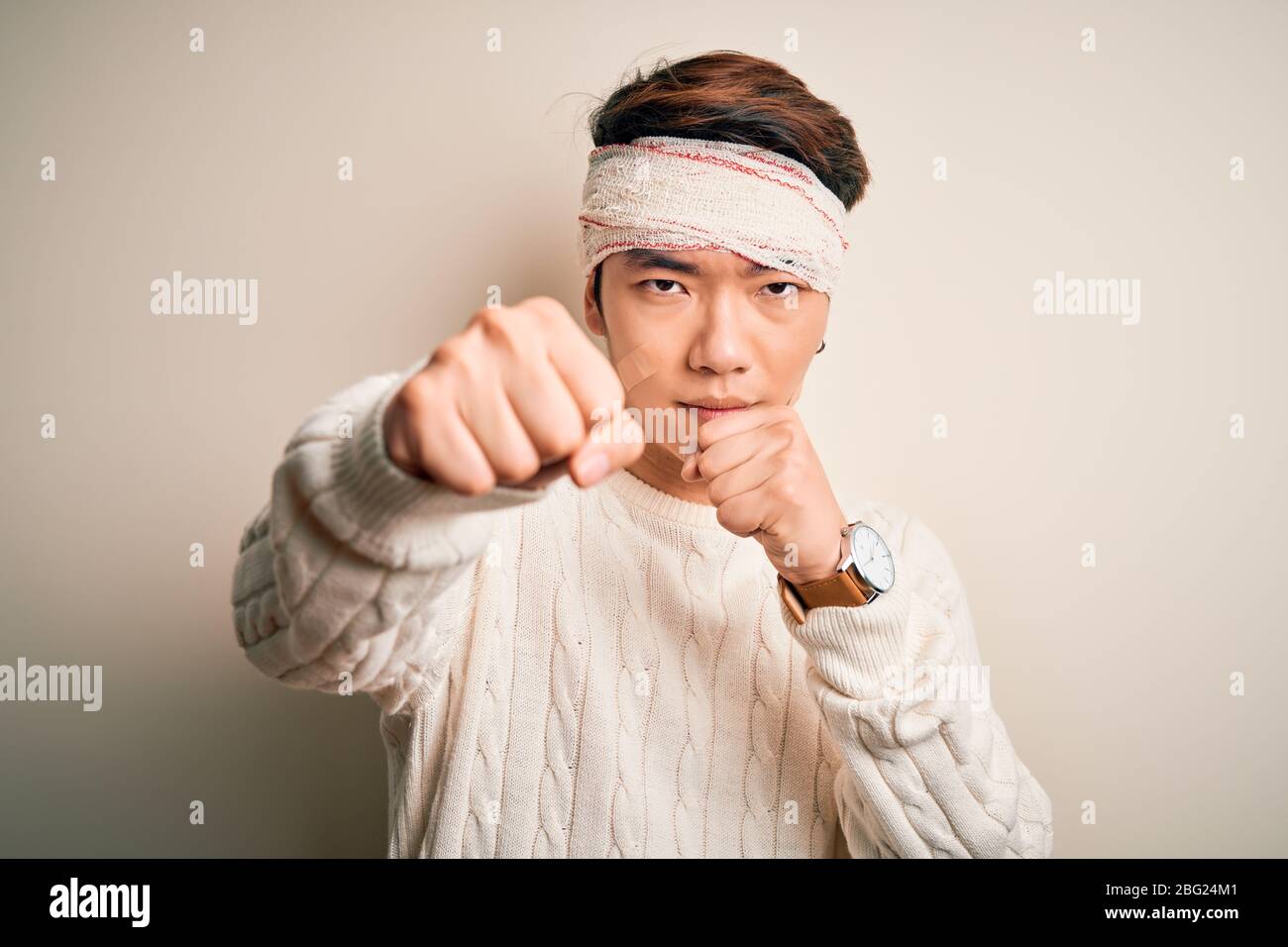 Young handsome chinese man injured for accident wearing bandage and ...
