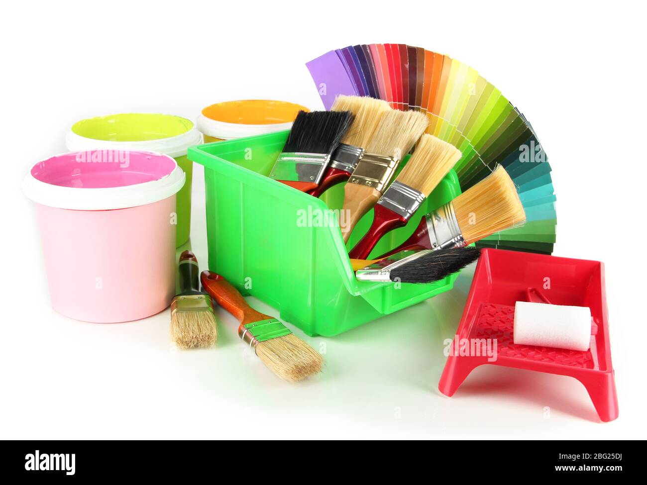 Paint pots, paintbrushes and coloured swatches isolated on white Stock ...