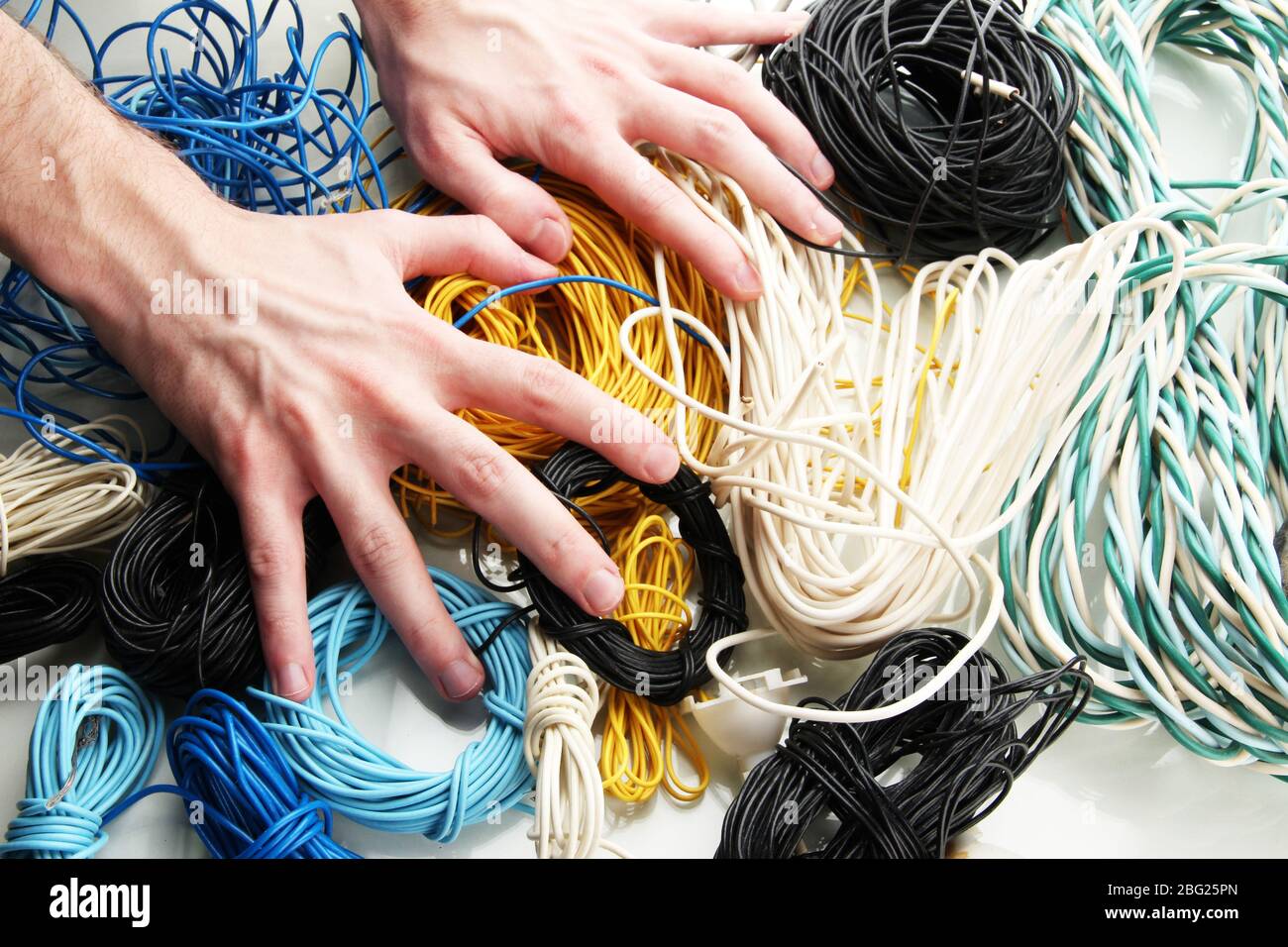 Cables and man hands, close up Stock Photo - Alamy