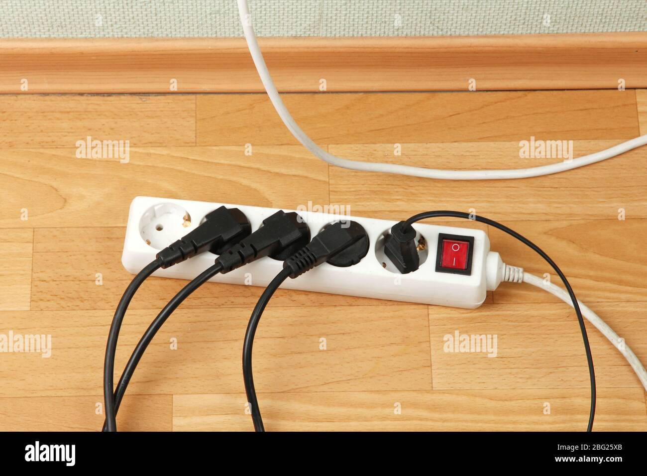 Overloaded power boards, close up Stock Photo - Alamy