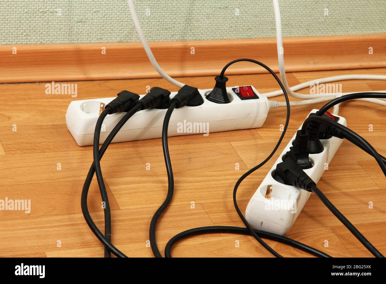 Overloaded power boards, close up Stock Photo - Alamy