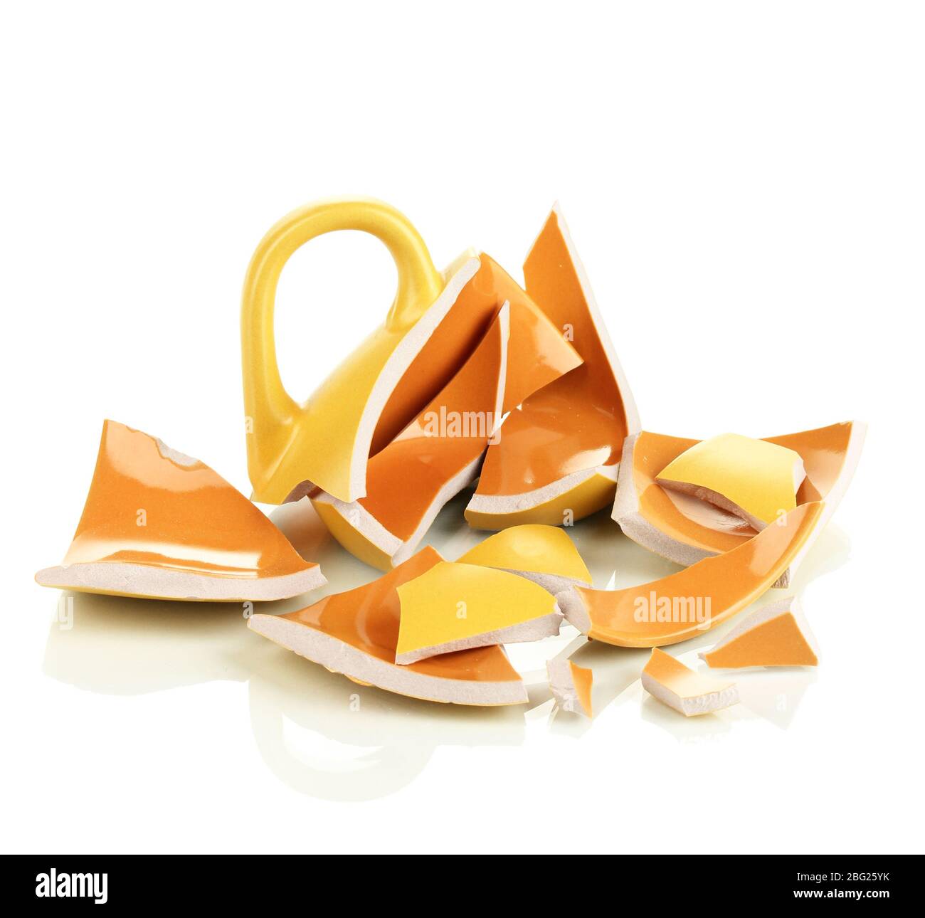 Yellow broken cup isolated on white Stock Photo - Alamy