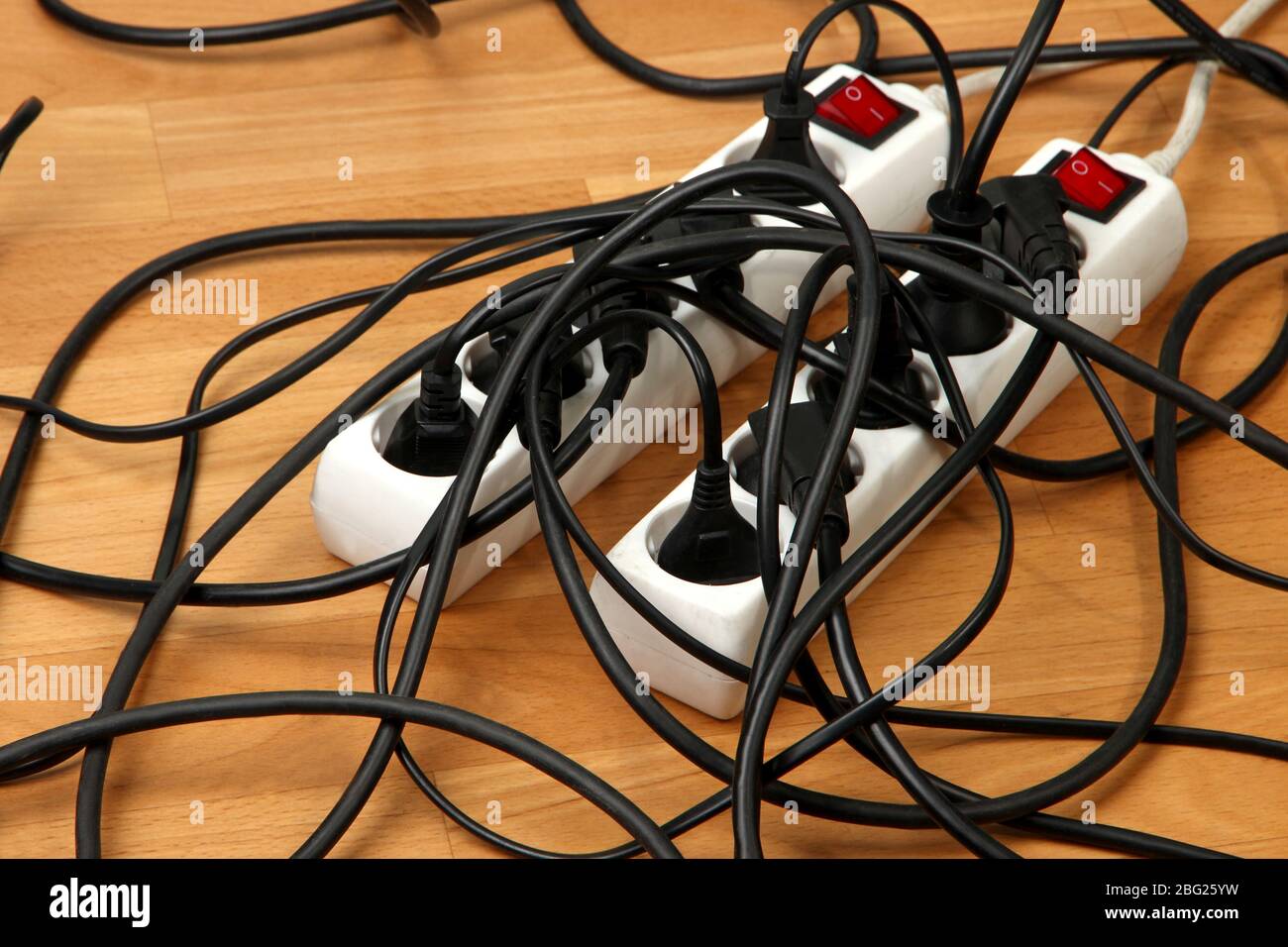 Overloaded power boards, close up Stock Photo - Alamy