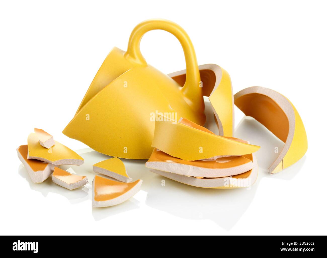 Yellow broken cup isolated on white Stock Photo - Alamy