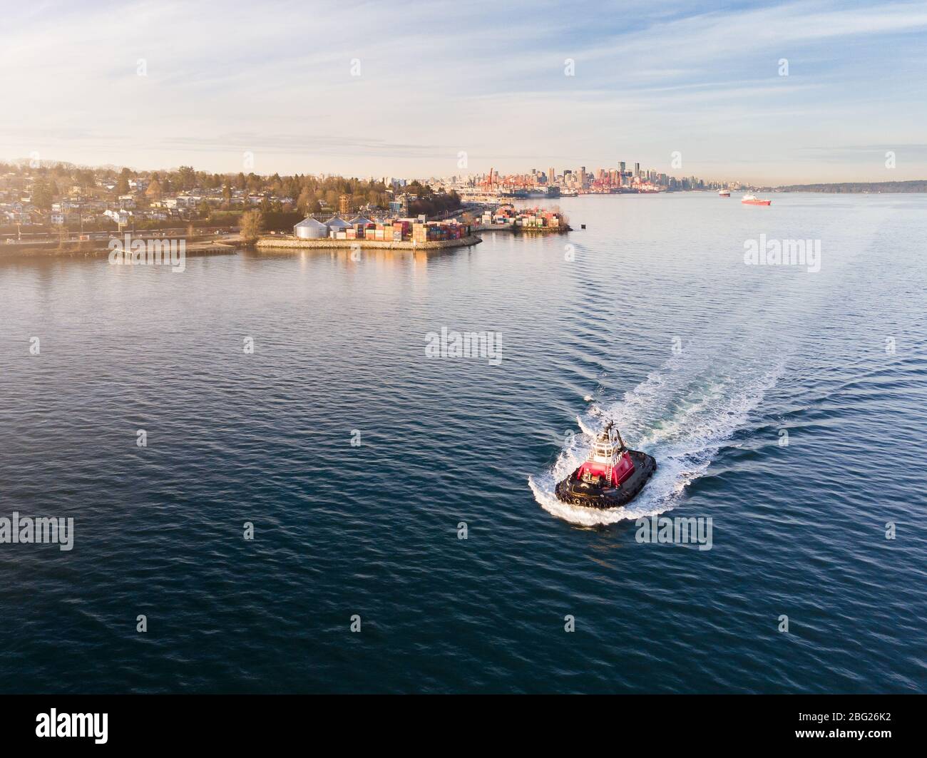 Aerial drone footage of a containers shipyard and cargo ship loading ...