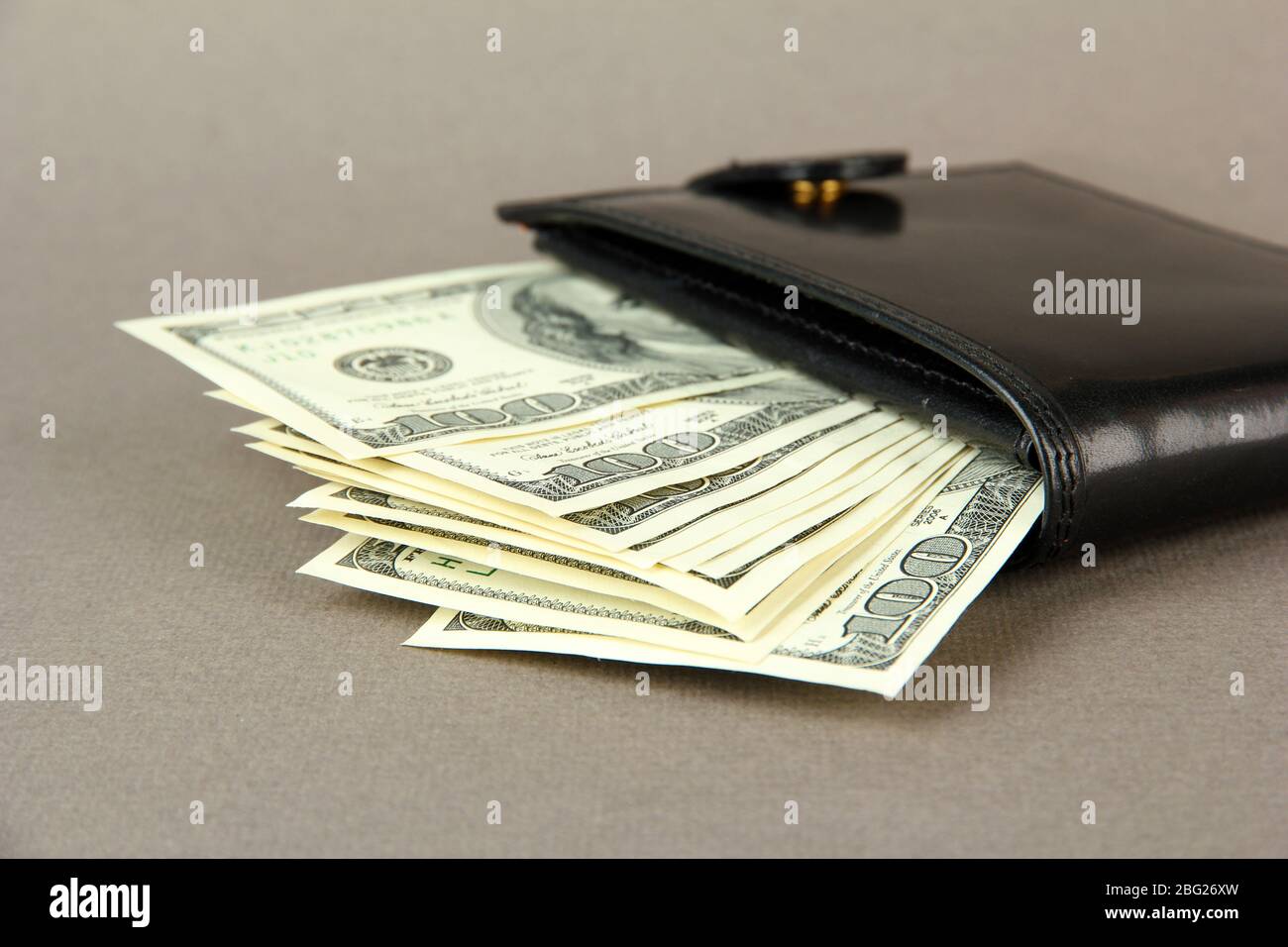 Wallet with hundred dollar banknotes, on color background Stock Photo ...
