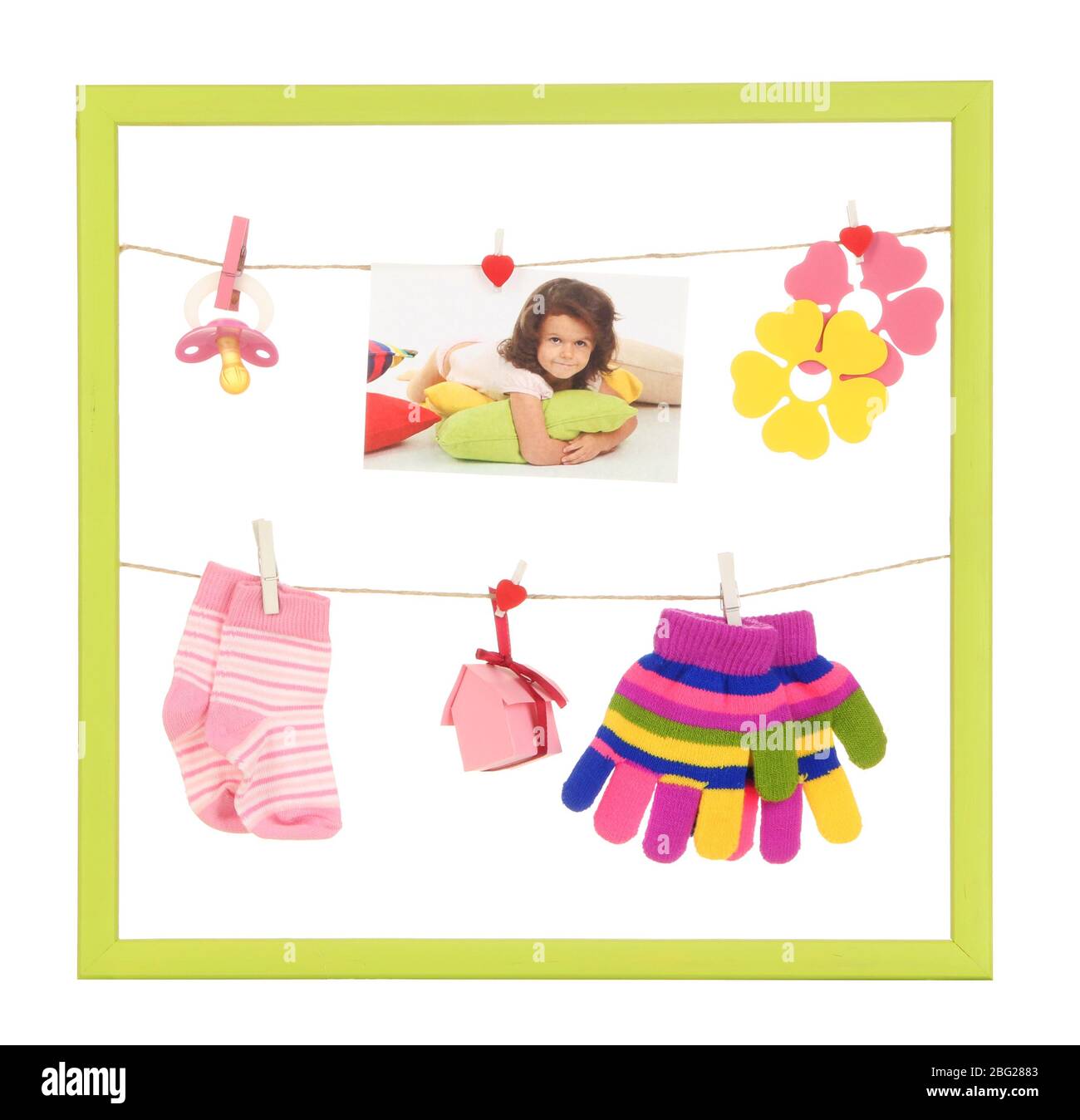 Colorful frame with different things on rope isolated on white Stock ...