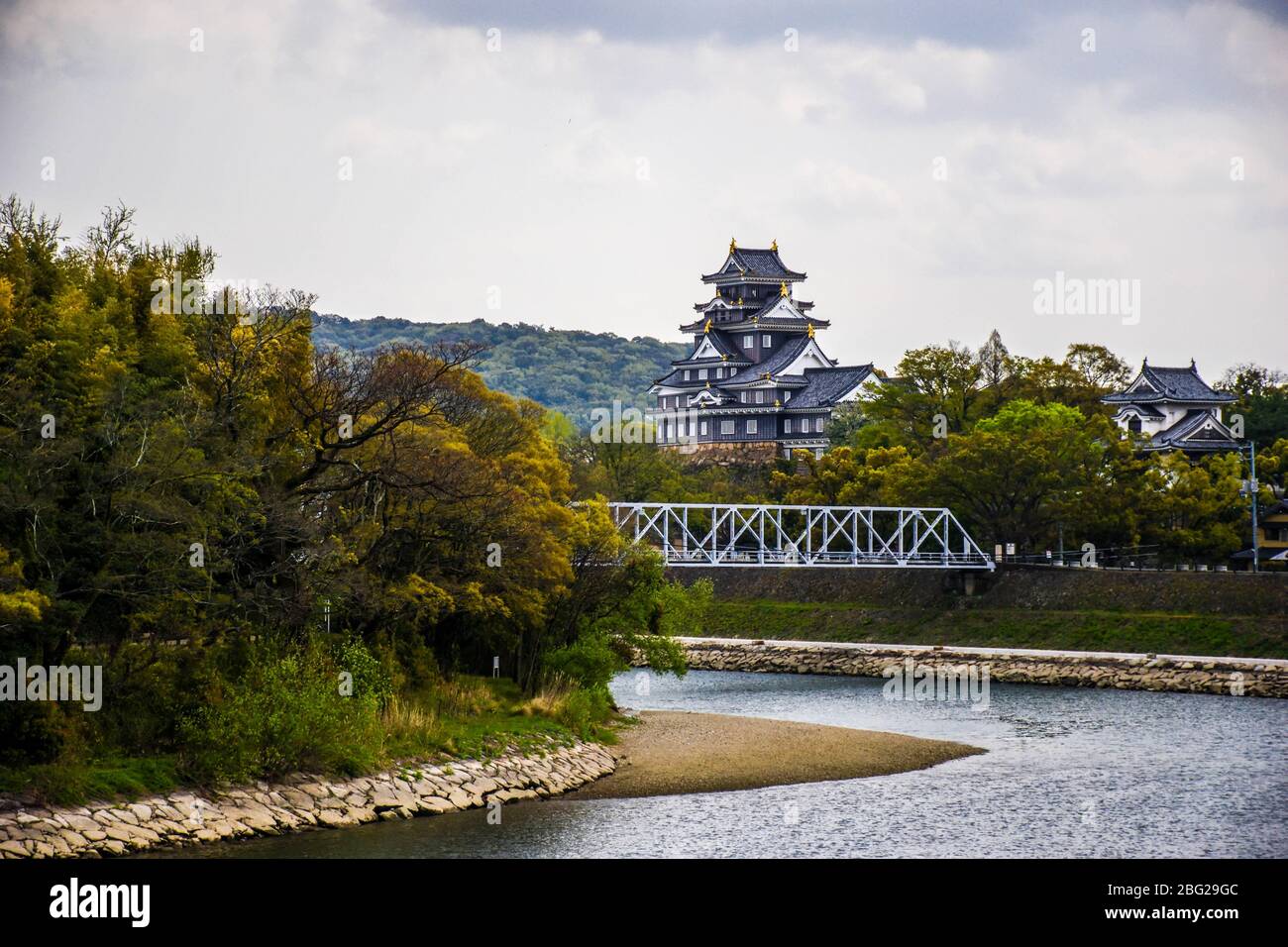 Stately large Okayama castle on the bank river in Japan Stock Photo - Alamy