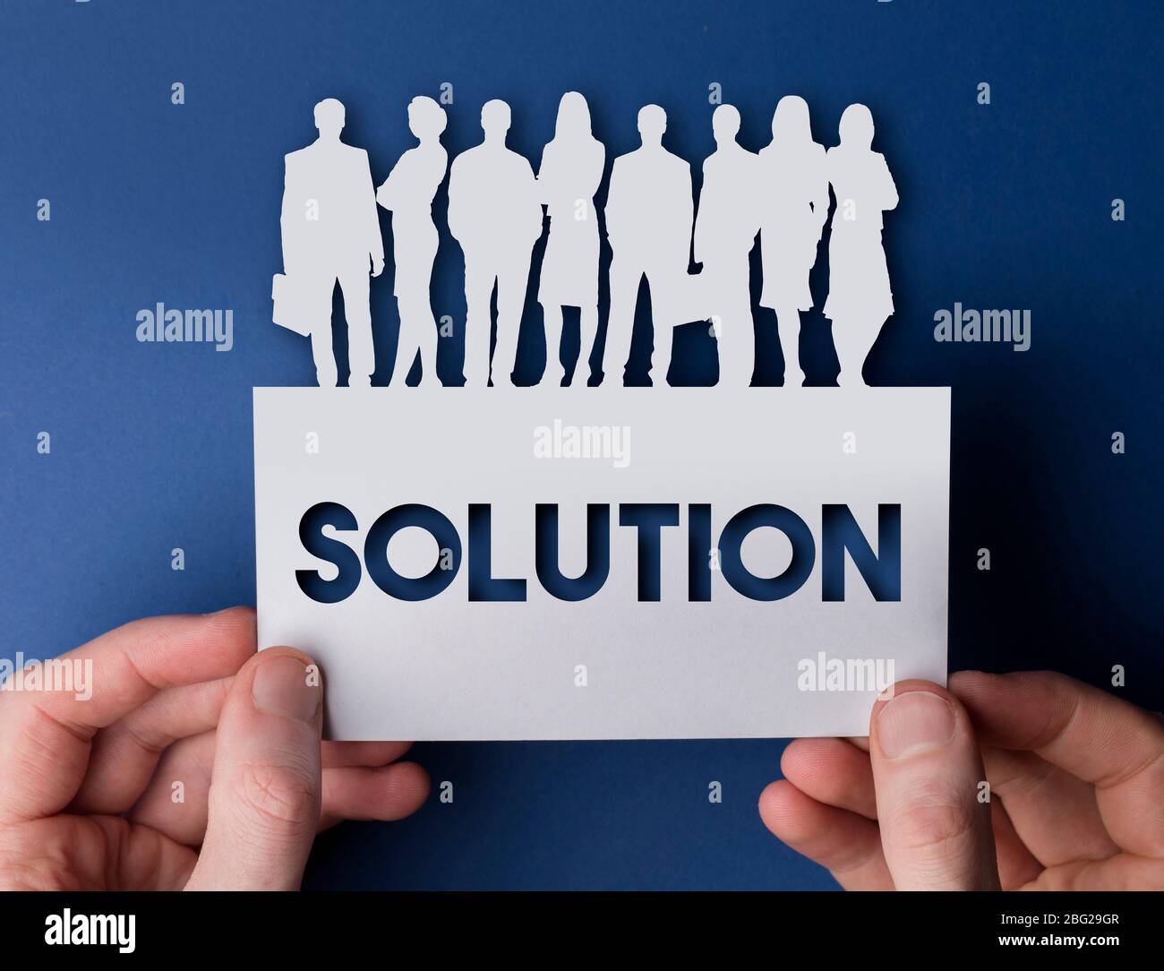 Hands holding a solution white card business team people sign Stock ...