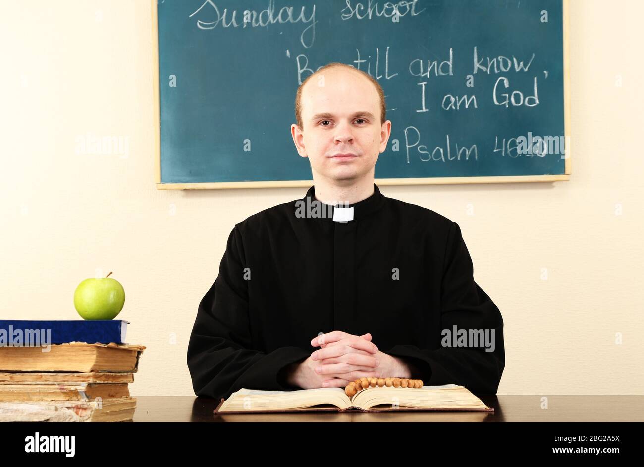 Priest in Sunday school Stock Photo - Alamy