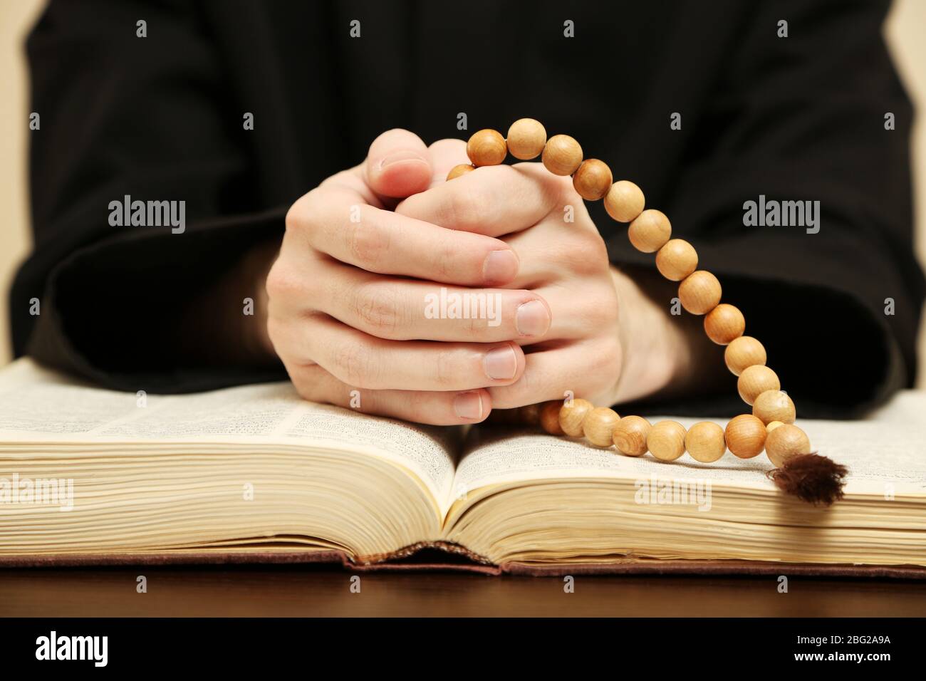 Priest reading from the holy bible, close up Stock Photo - Alamy