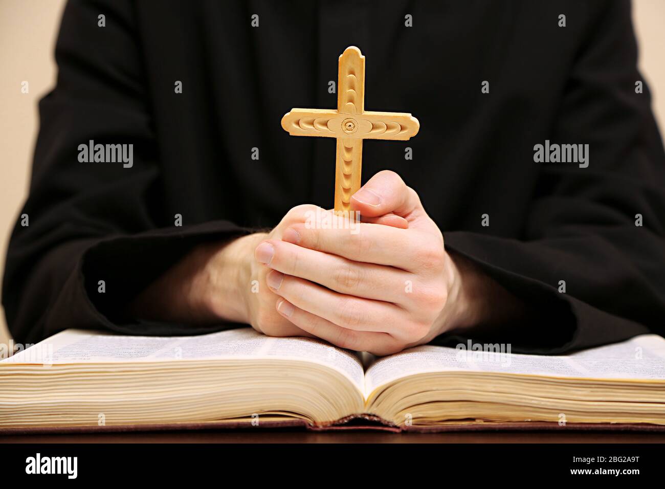 Priest reading from the holy bible, close up Stock Photo - Alamy