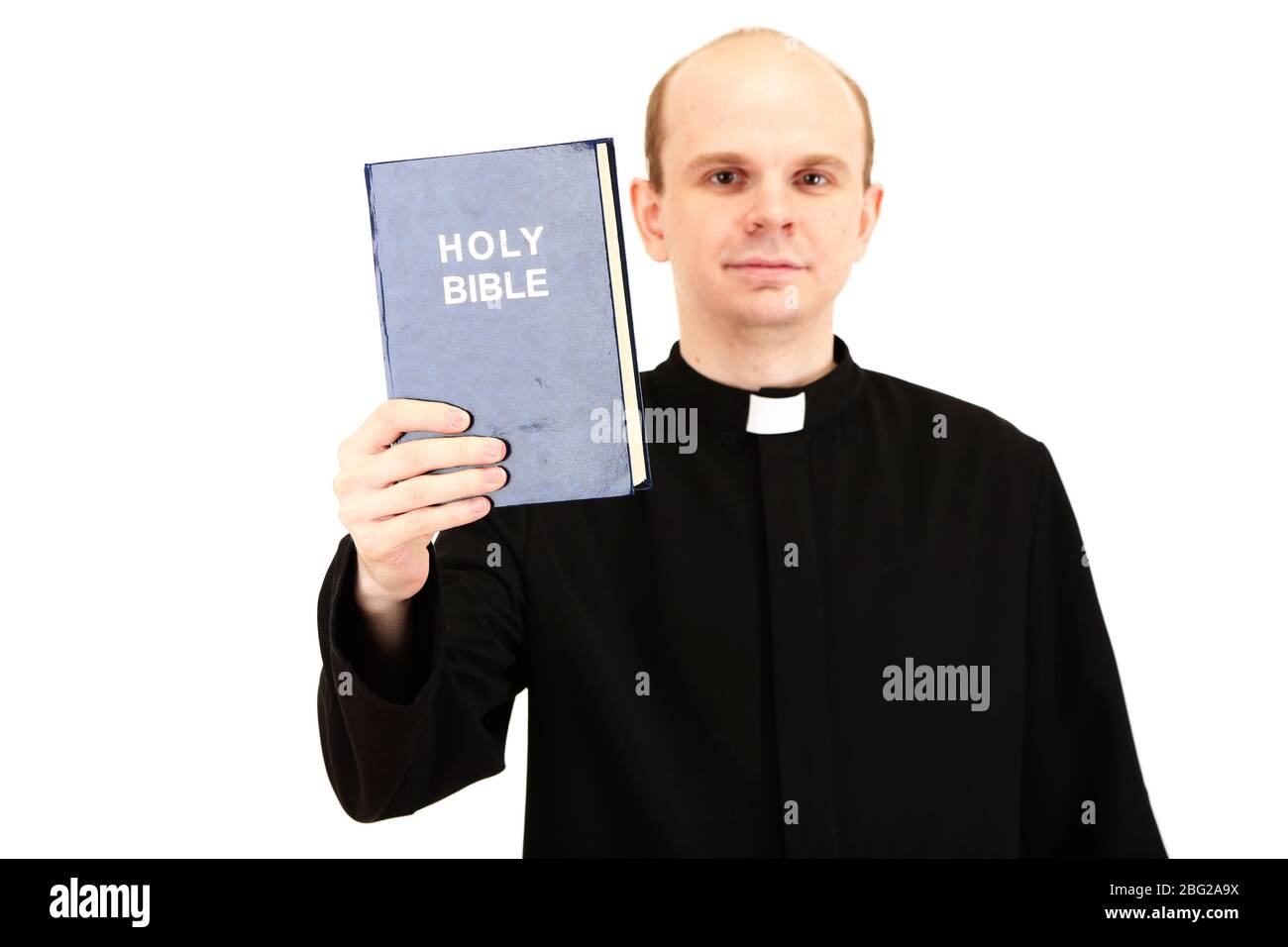 Priest with Holly Bible, isolated on white Stock Photo - Alamy