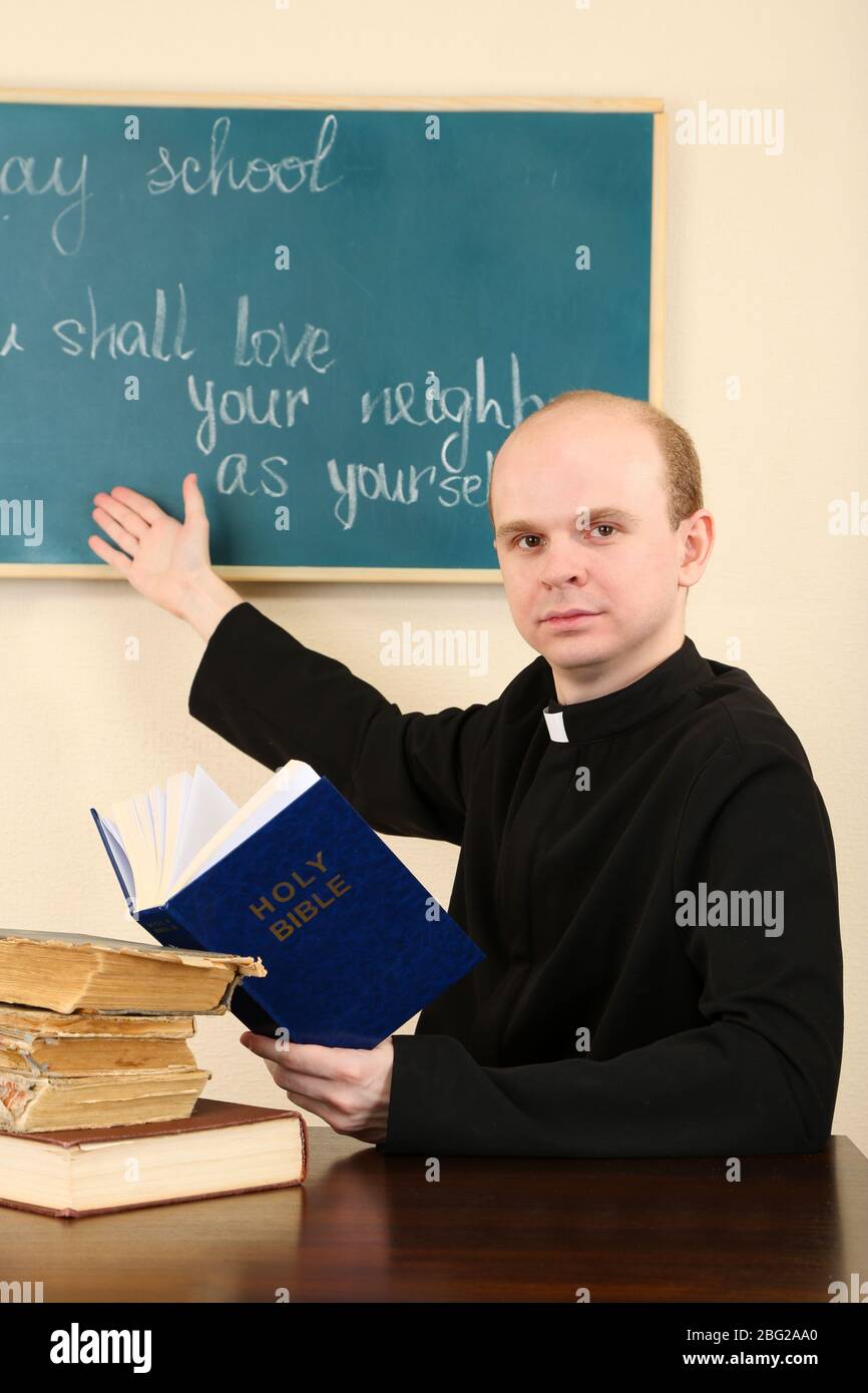 Priest in Sunday school Stock Photo - Alamy