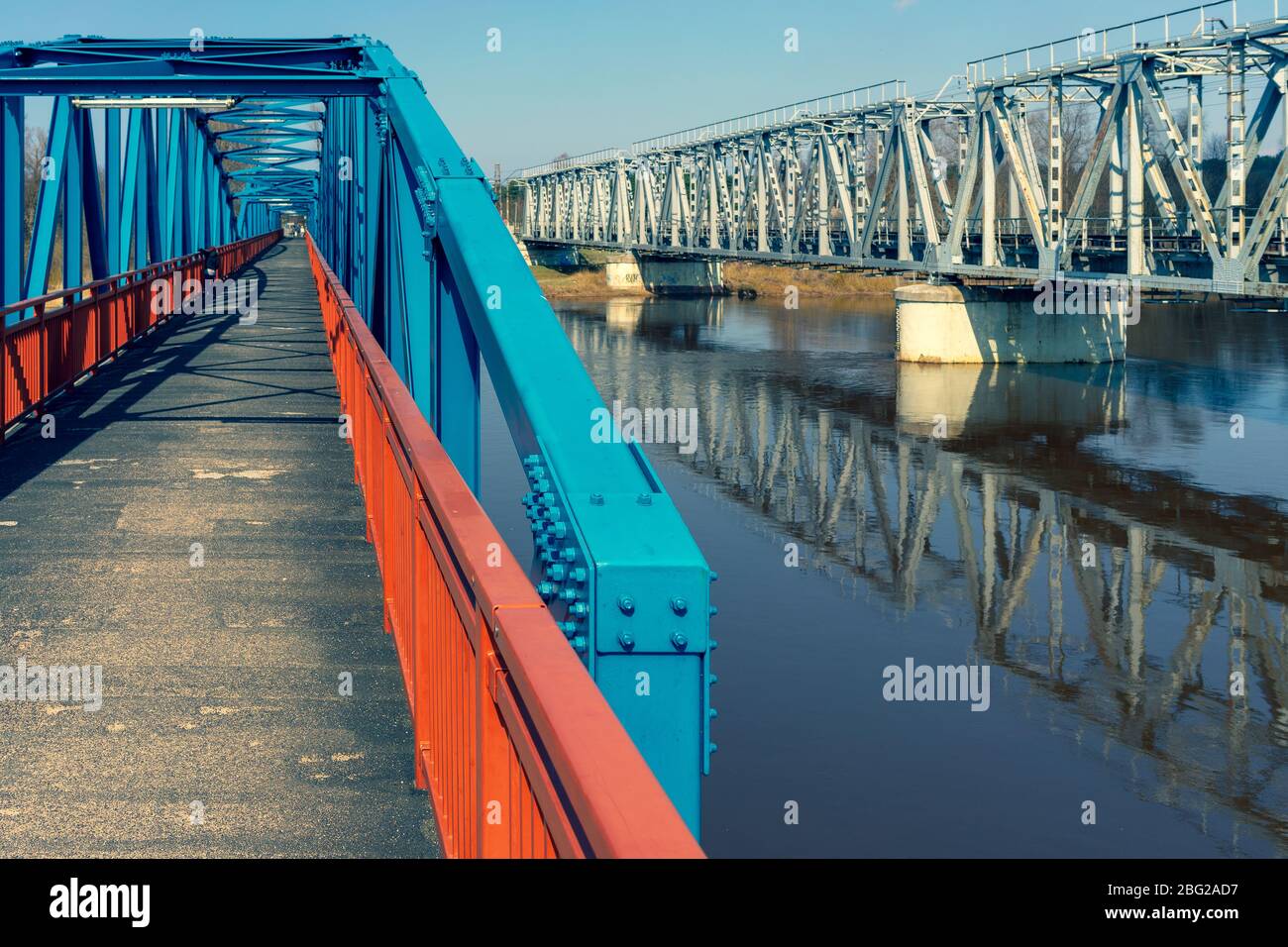 Pedestrian and railway bridges over the river Stock Photo - Alamy