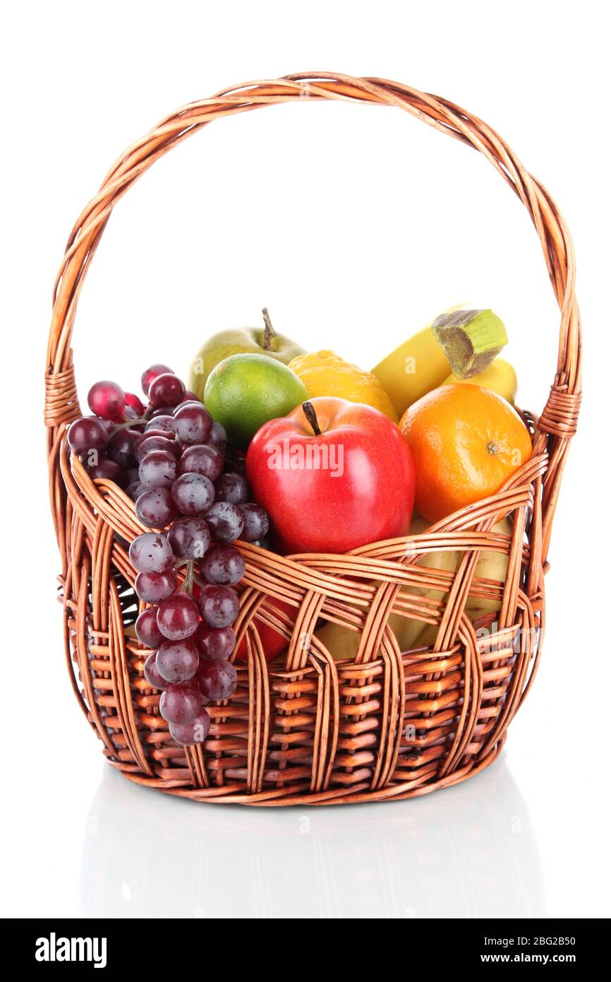 Different fruits in wicker basket isolated on white Stock Photo - Alamy