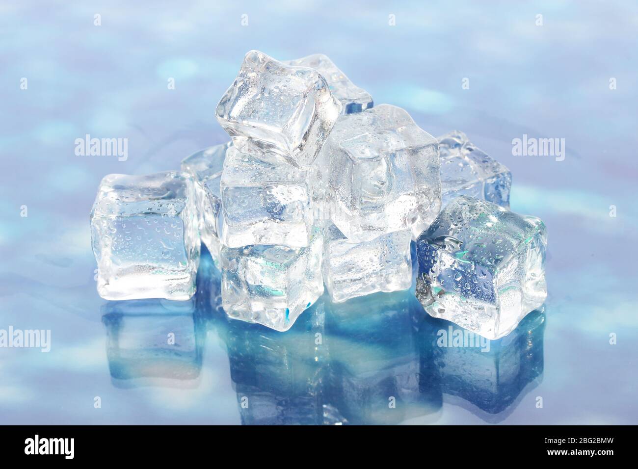 Ice cubes on the background water Stock Photo - Alamy