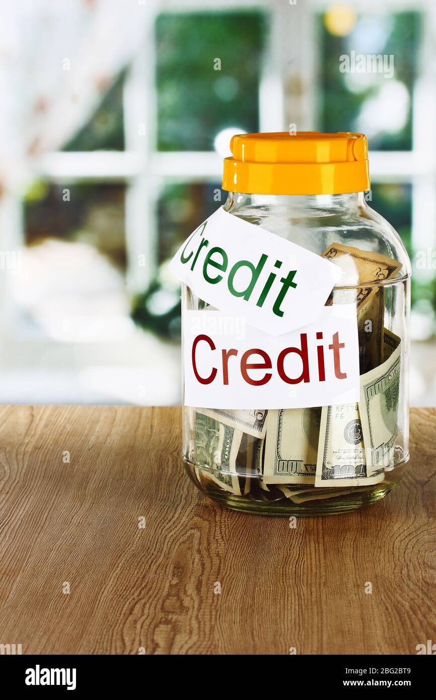 Money in the bank on bright background Stock Photo - Alamy