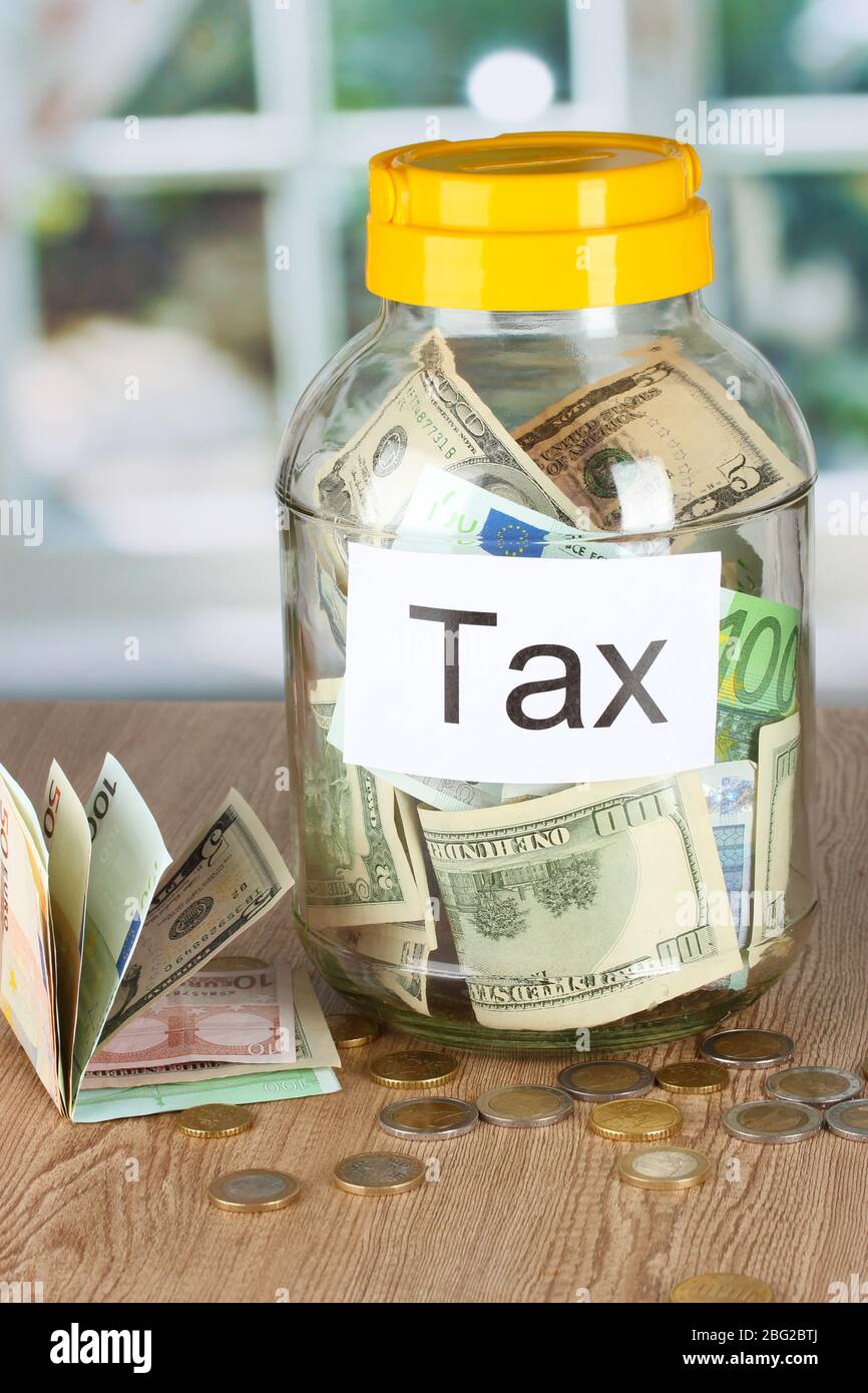 Money in the bank on room background Stock Photo - Alamy