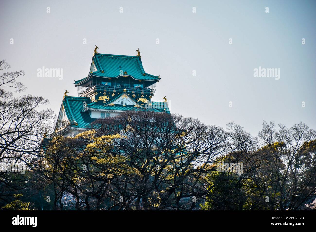 Beautiful blue Osaka castle above the secon largest city in Japan ...