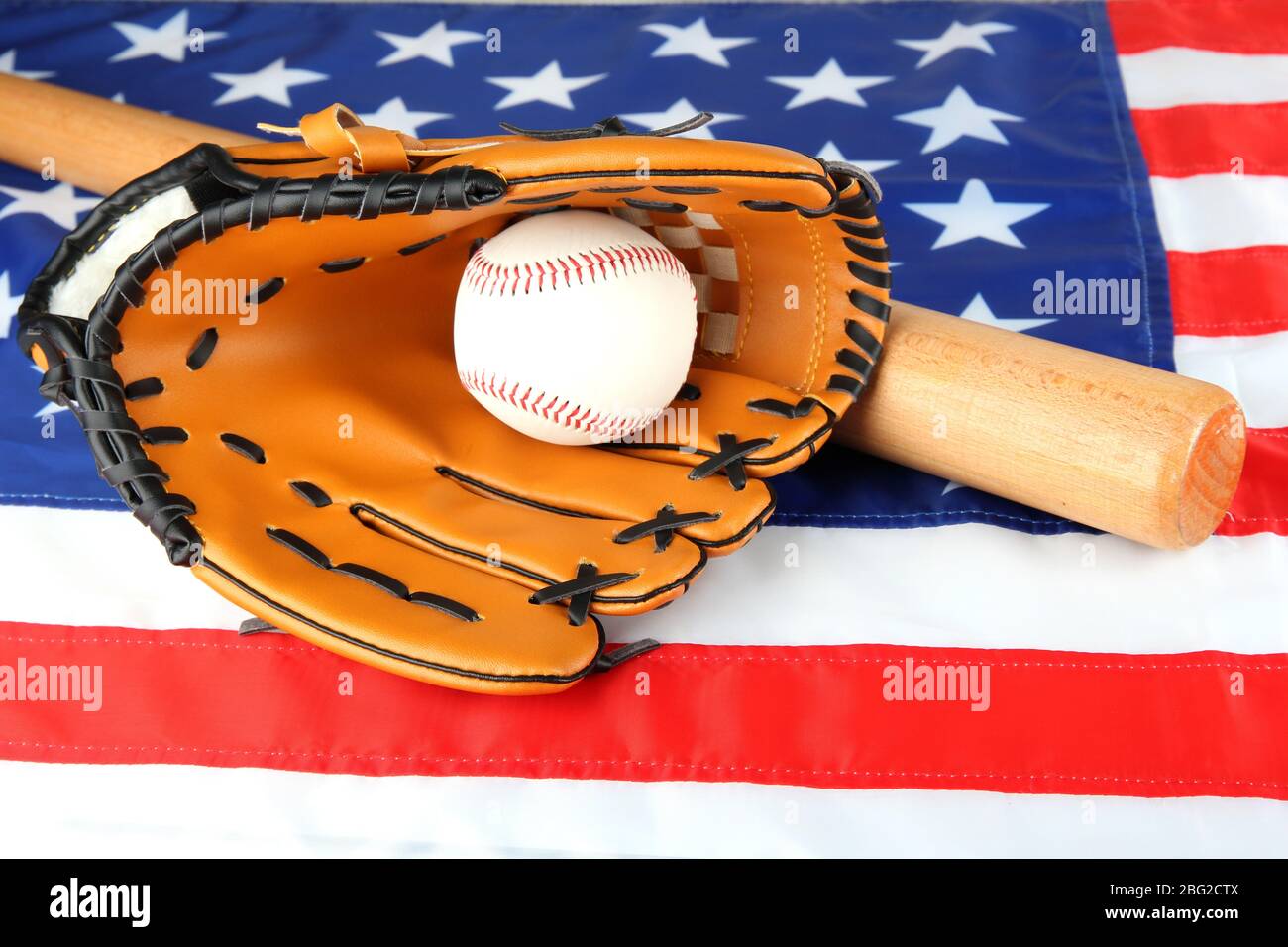 Baseball glove, bat and ball on American flag background Stock Photo ...