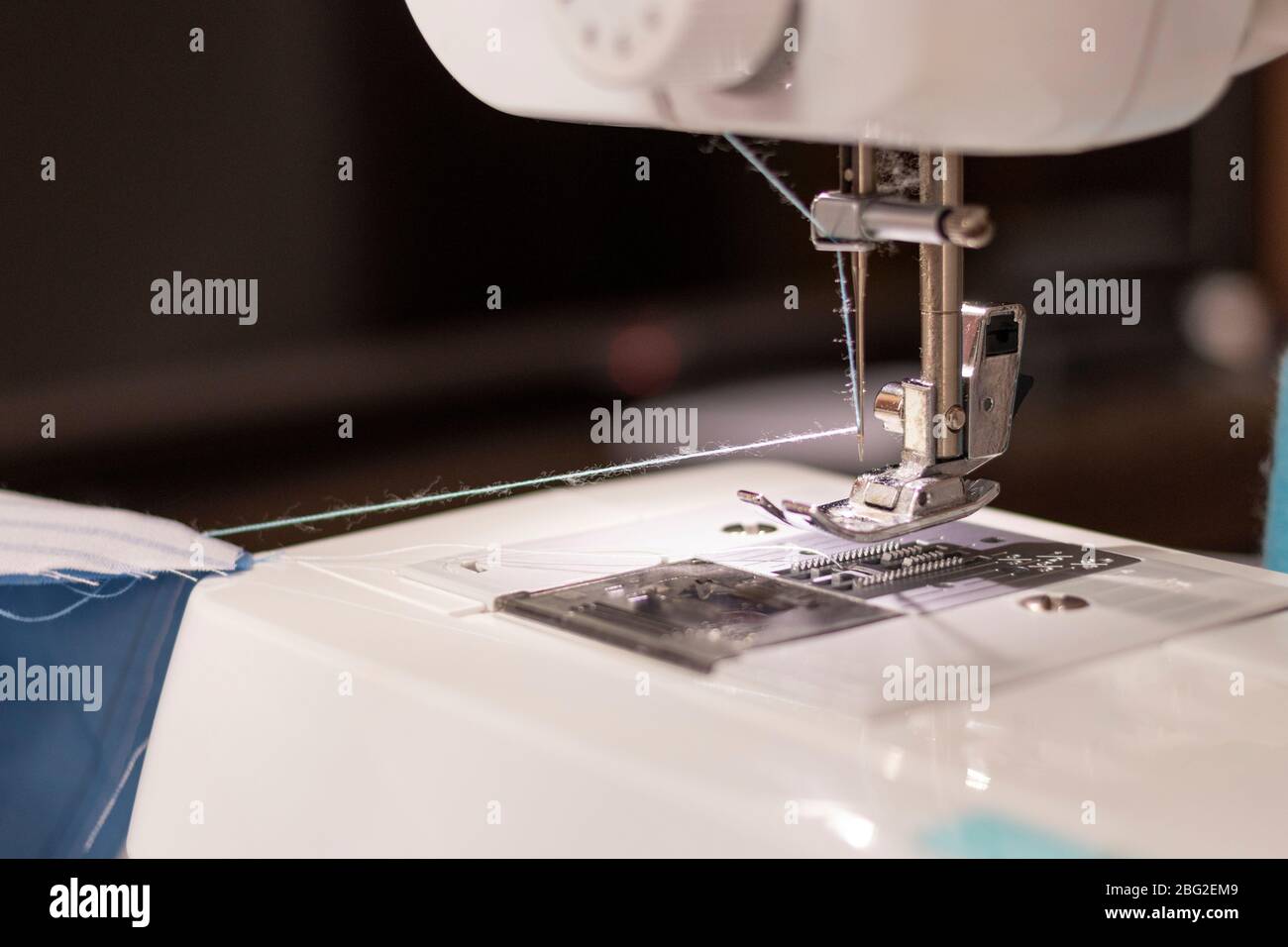 Sewing machine worked by a seamstress Stock Photo - Alamy