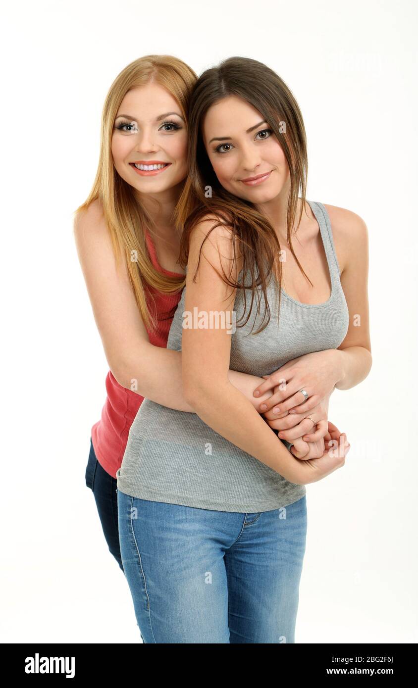 Two girl friends hugging isolated on white Stock Photo - Alamy