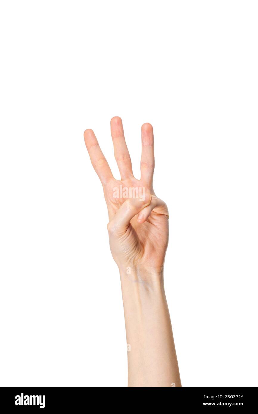 Young Caucasian female left hand, palm facing camera showing number 3 ...