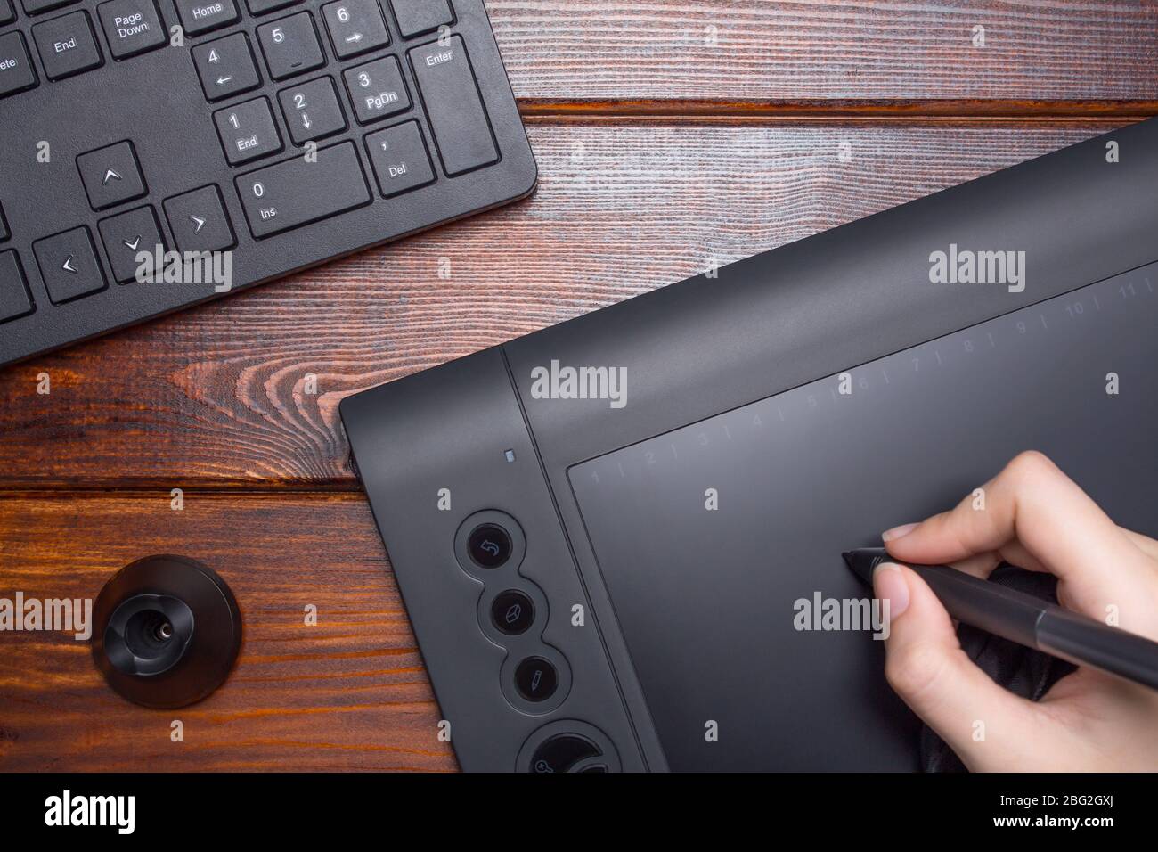 The hand draws on a graphics tablet. Freelance, designer, Illustrator ...