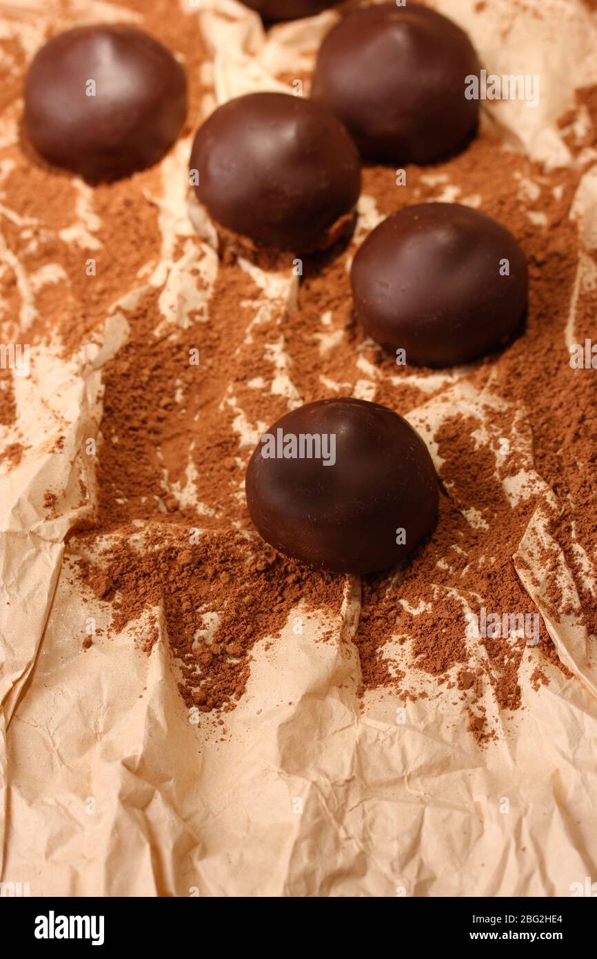 Chocolate candies with cocoa powder, close up Stock Photo - Alamy
