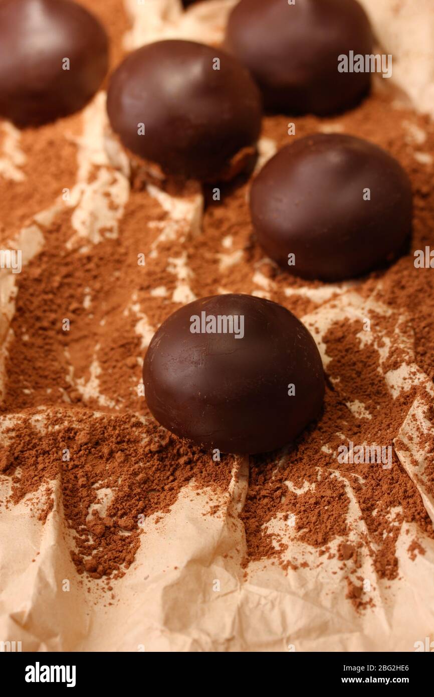 Chocolate candies with cocoa powder, close up Stock Photo - Alamy