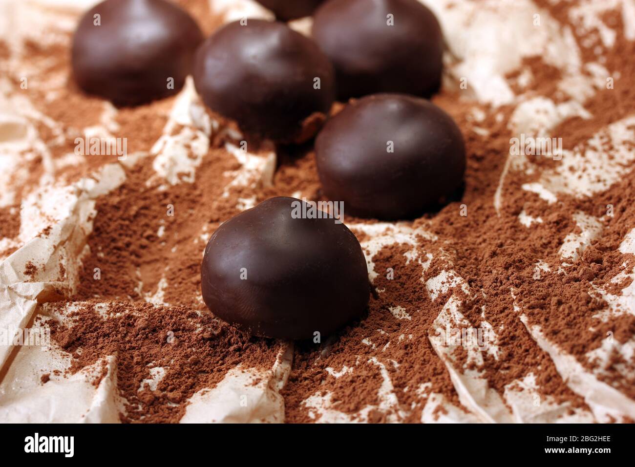 Chocolate candies with cocoa powder, close up Stock Photo - Alamy