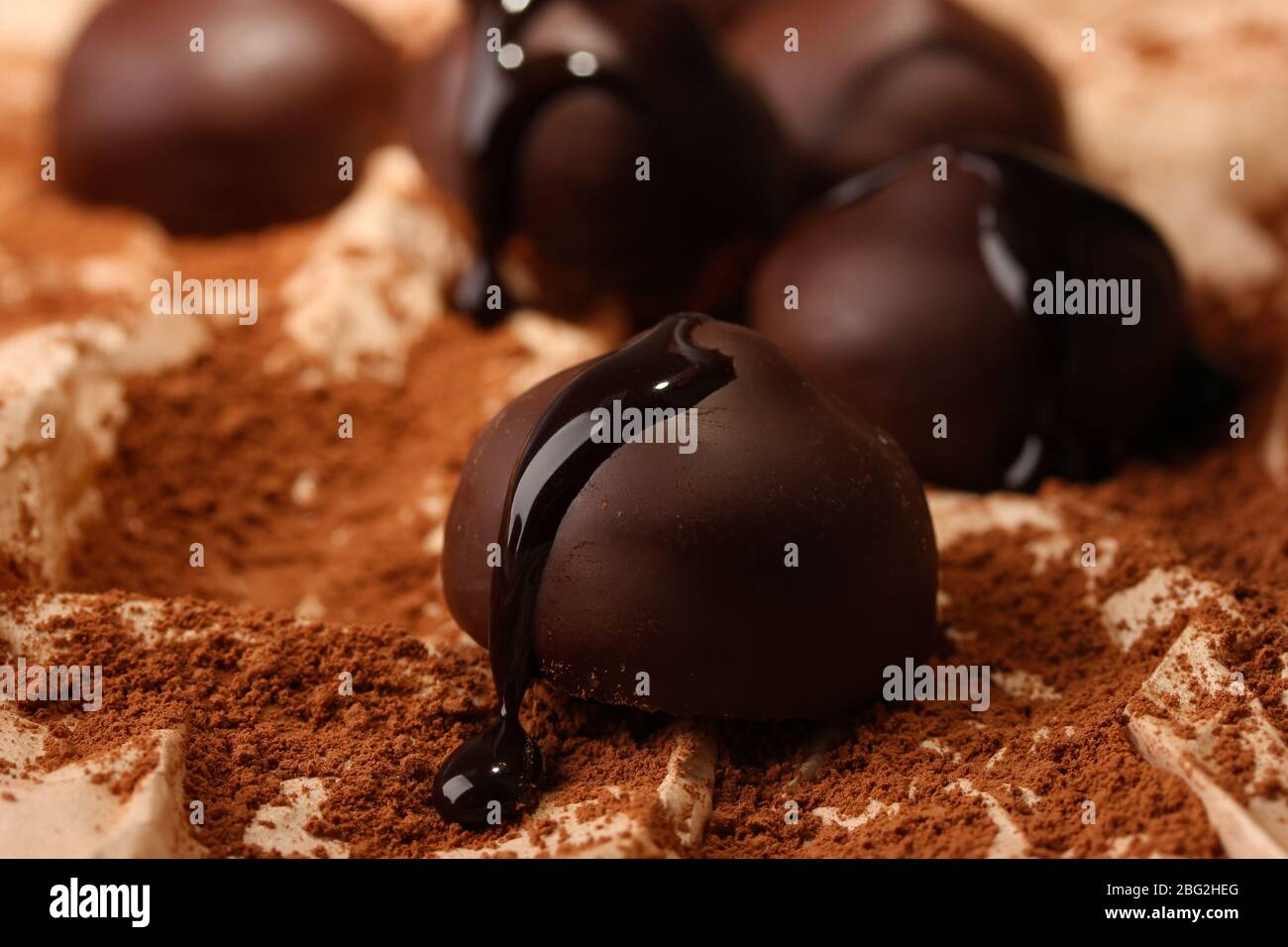 Chocolate candies with cocoa powder, close up Stock Photo - Alamy