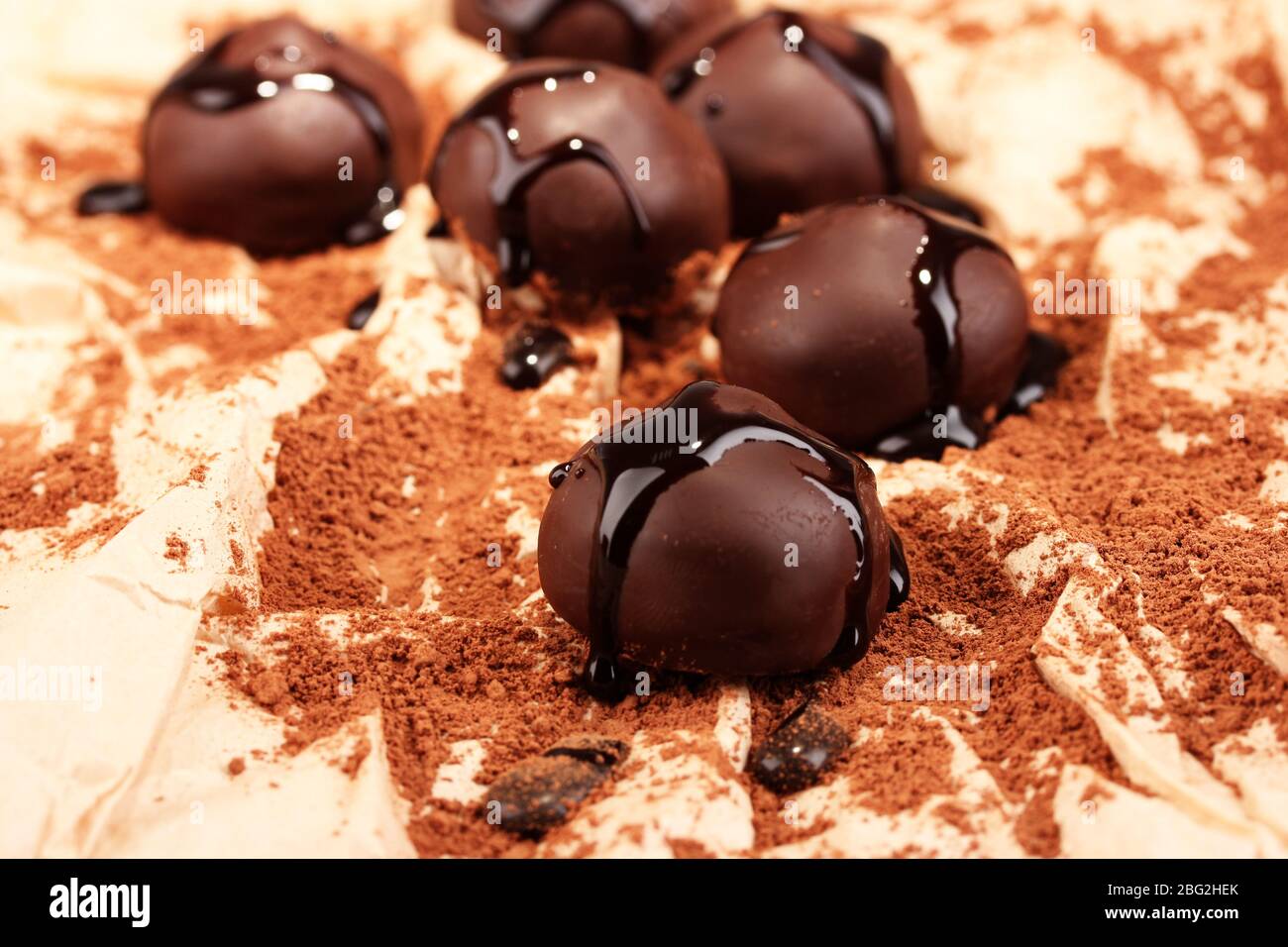Chocolate candies with cocoa powder, close up Stock Photo - Alamy