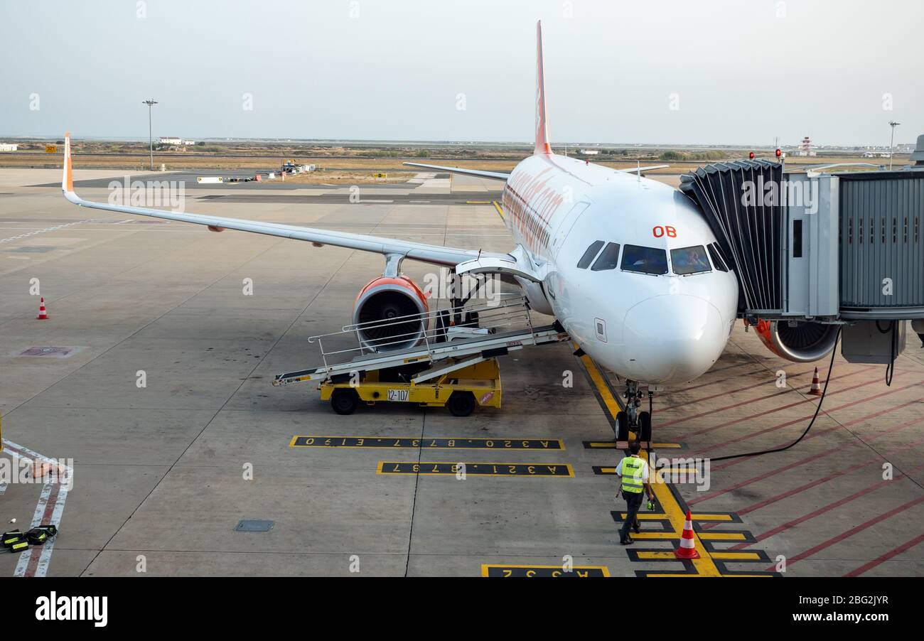 An EasyJet airplane standing at a gate at Faro International Airport ...