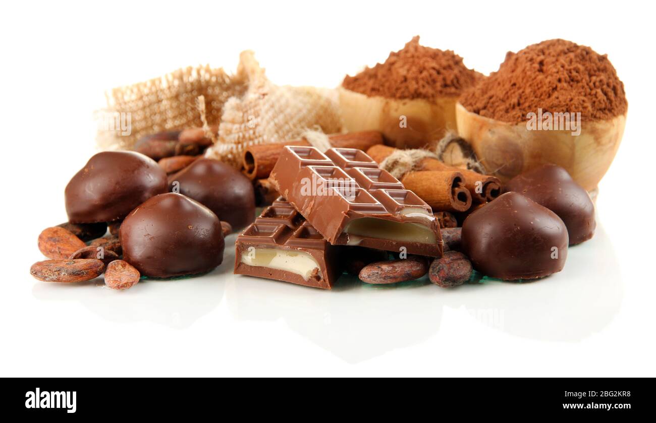 Composition of chocolate sweets, cocoa and spices, isolated on white ...