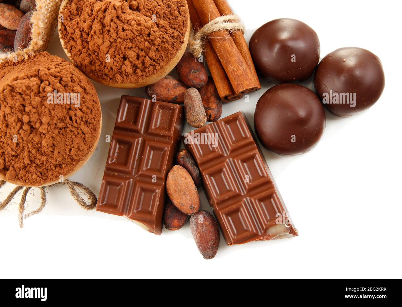Composition of chocolate sweets, cocoa and spices, isolated on white ...