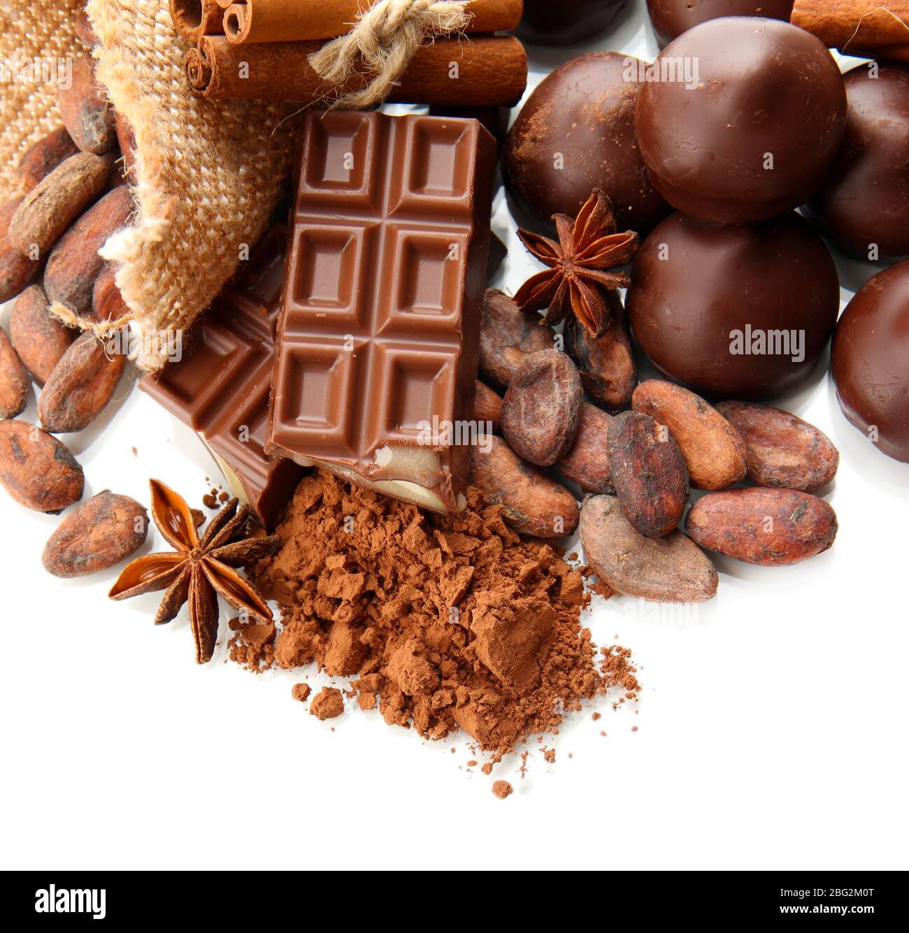 Composition of chocolate sweets, cocoa and spices, isolated on white ...