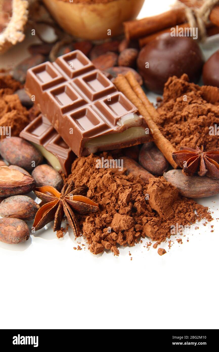 Composition of chocolate sweets, cocoa and spices, isolated on white ...