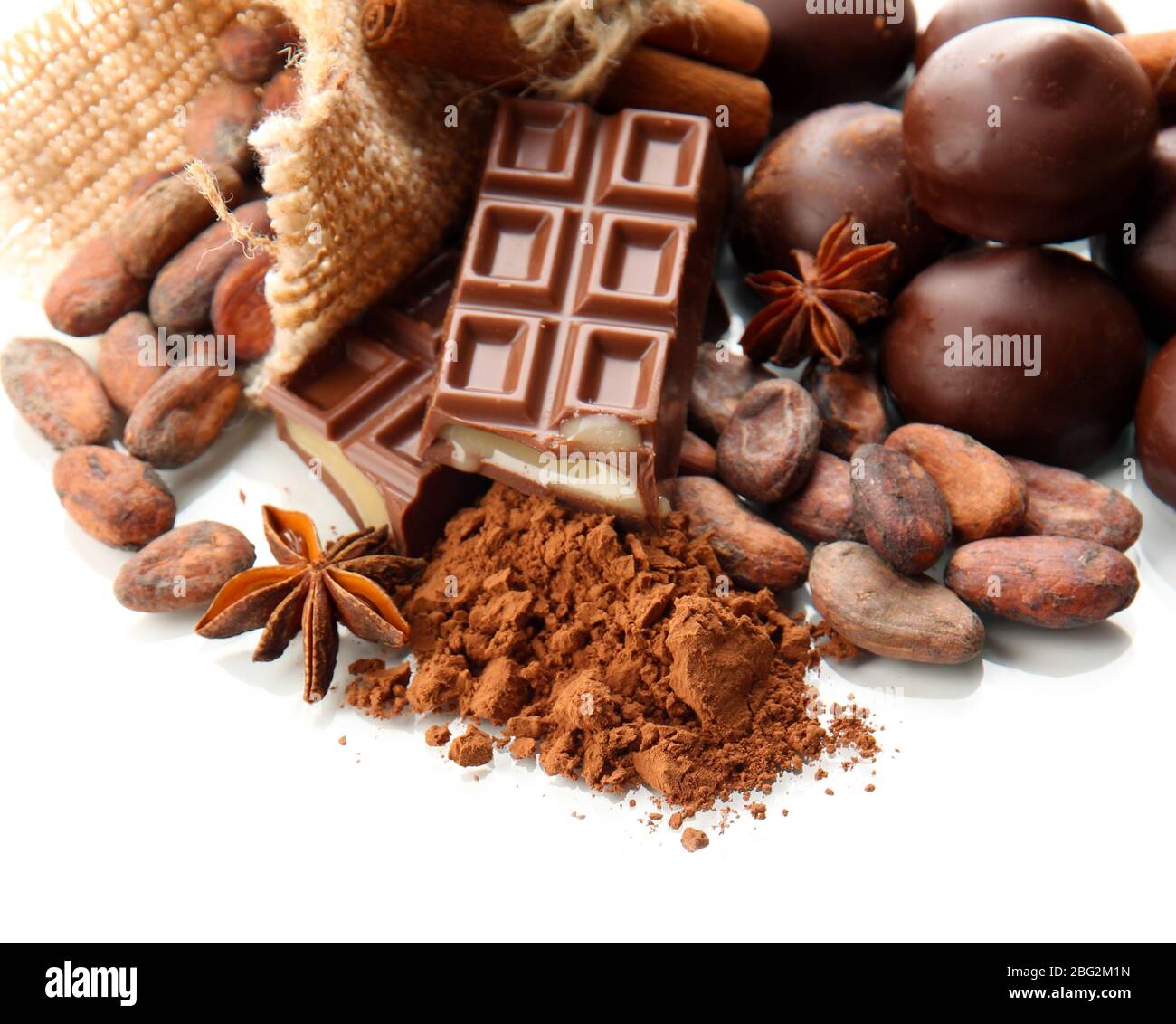 Composition of chocolate sweets, cocoa and spices, isolated on white ...